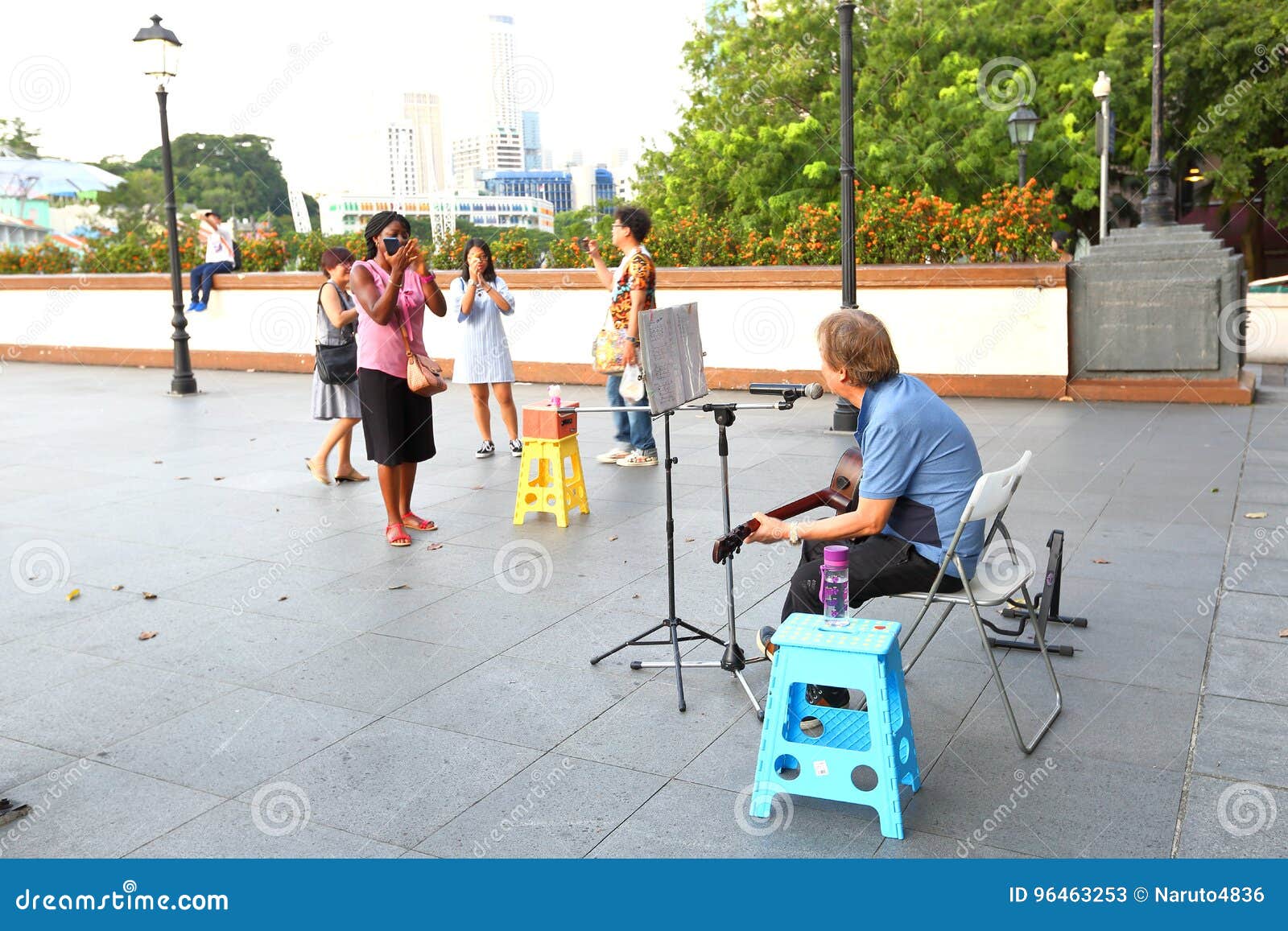Street busker in Singapore editorial stock photo. Image of entertain ...