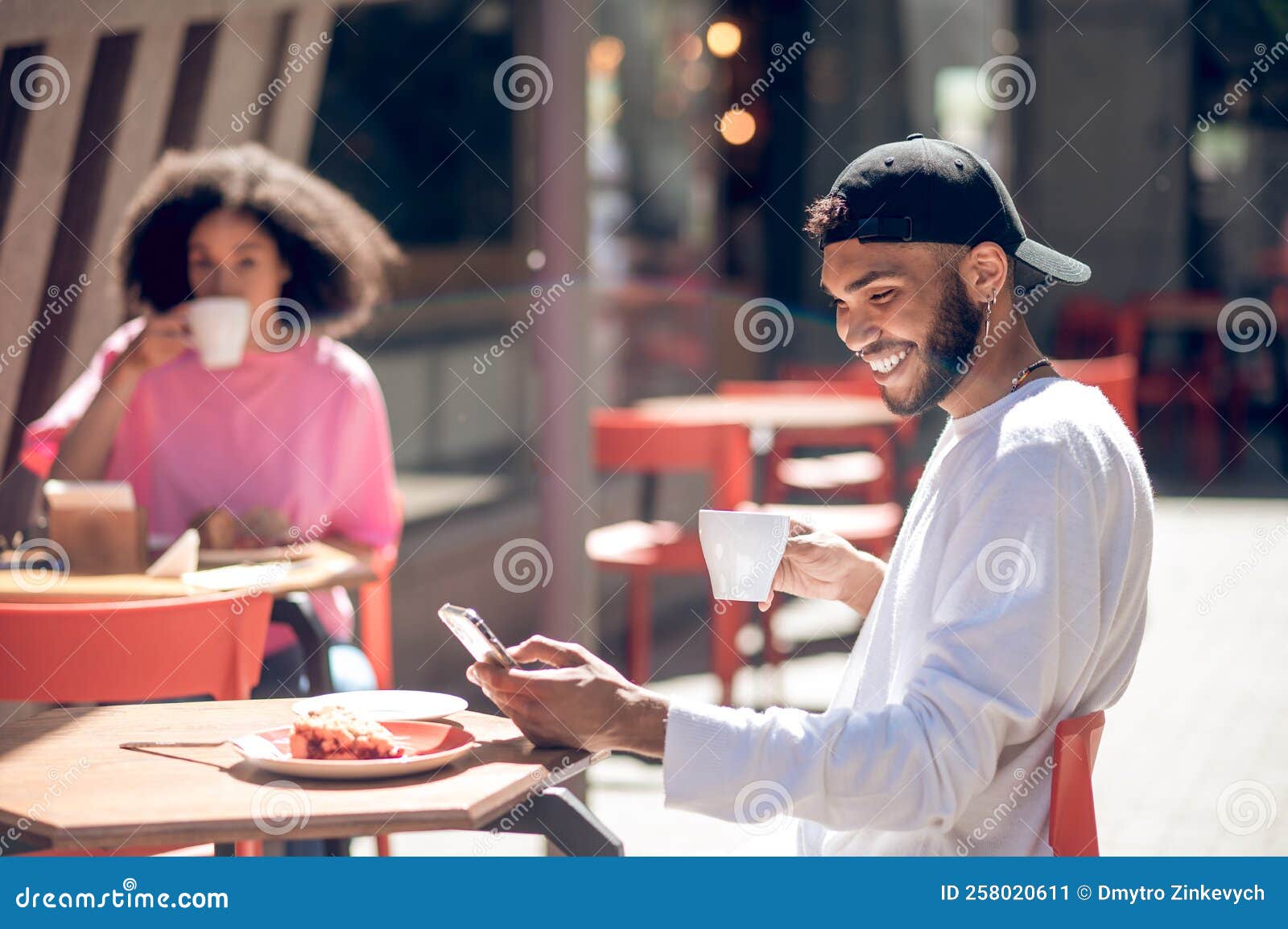 Two Young People Having Coffee at the Street Cafe Stock Image - Image ...
