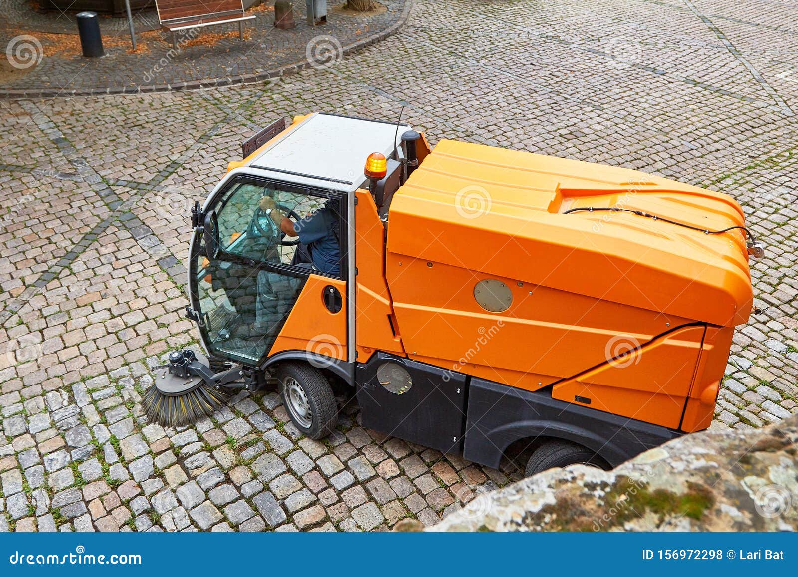 Street Cleaning Machine Sweeping a Cobblestone Road Stock Photo - Image ...