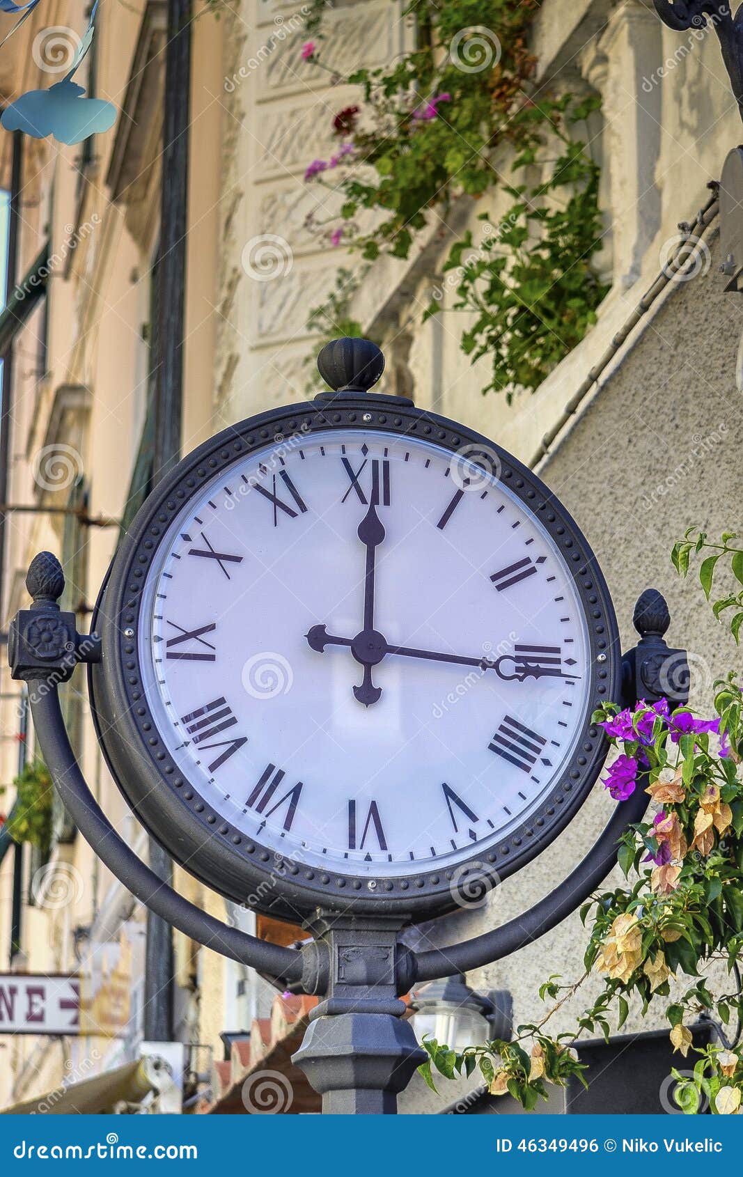 Street clock stock photo. Image of street, flowers, building - 46349496