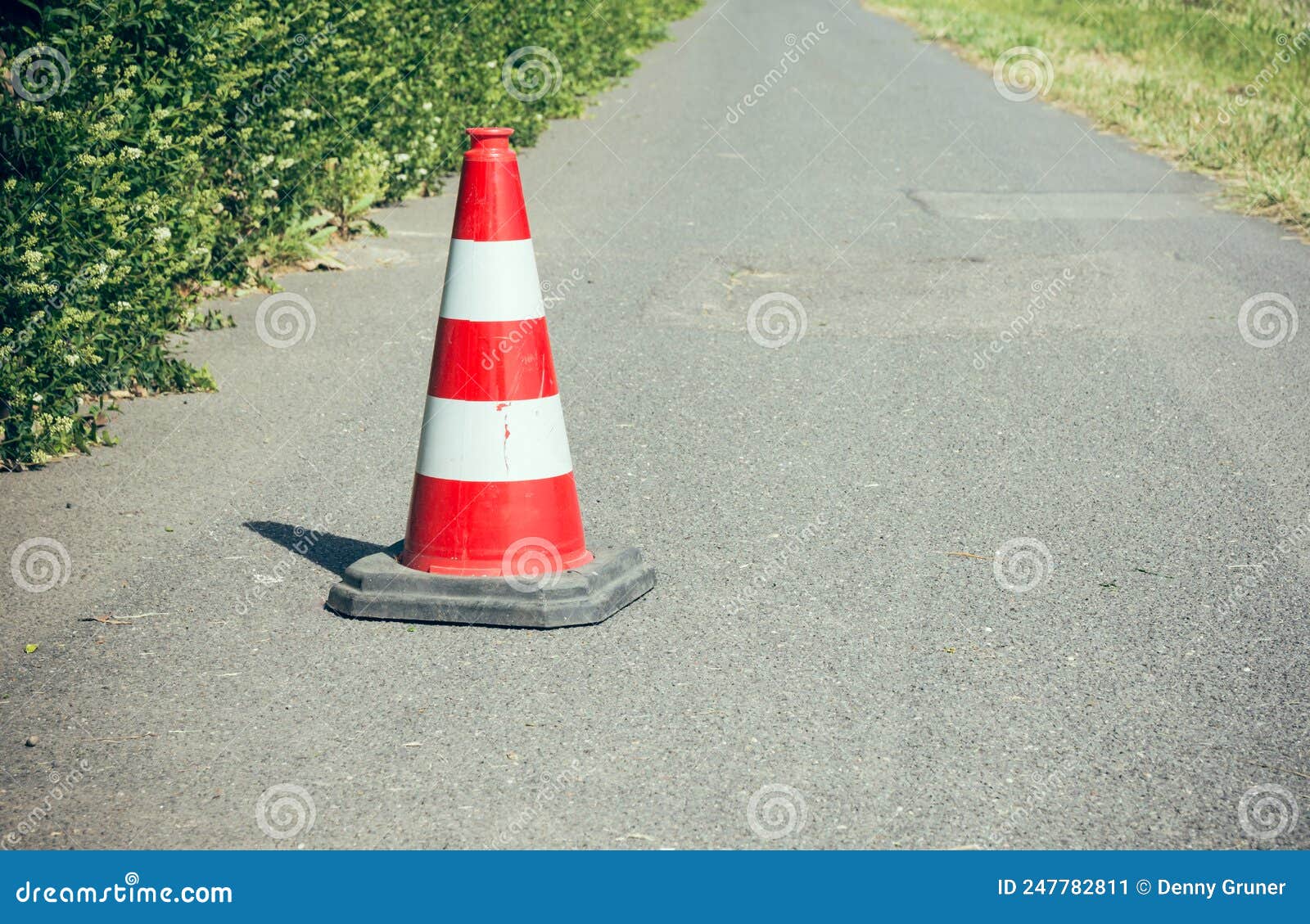 Street Cone on a Sidewalk in the Sunlight Stock Image - Image of ...