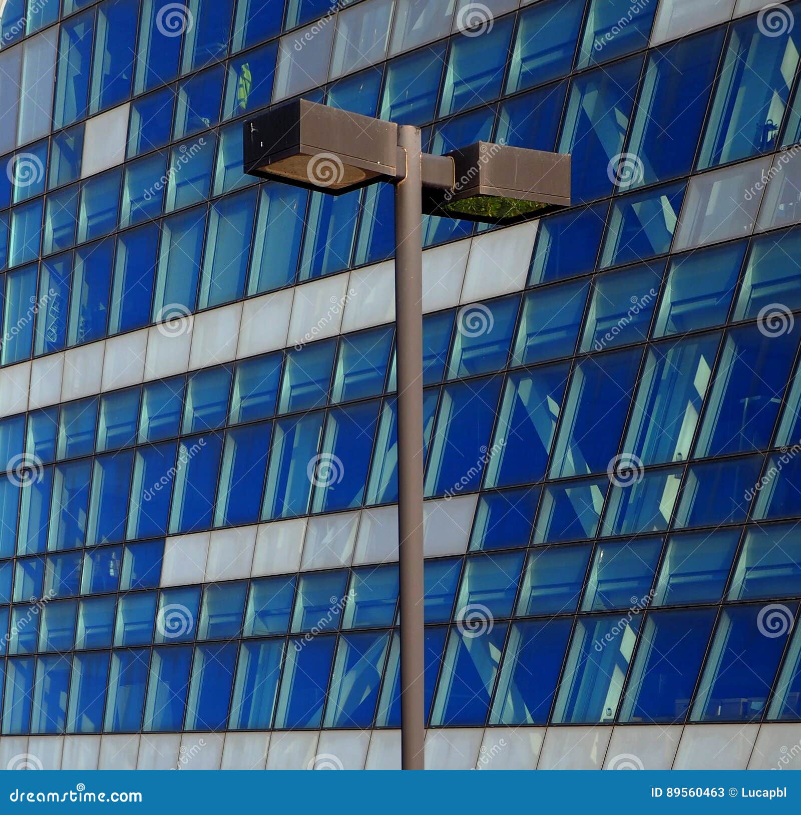 Street Lamp in Front of a Glass Building Stock Image - Image of lamp ...