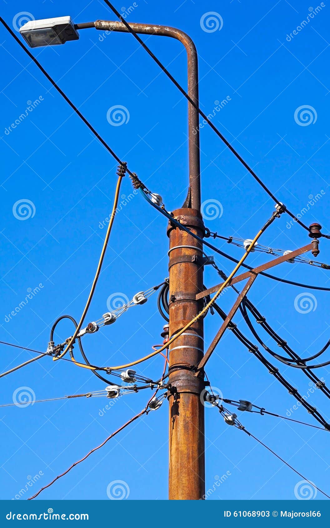 Street light with cables stock image. Image of danger - 61068903