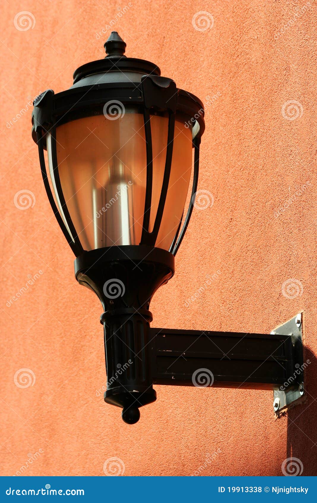 Street Light on the Side of a Building Stock Photo - Image of lamppost ...