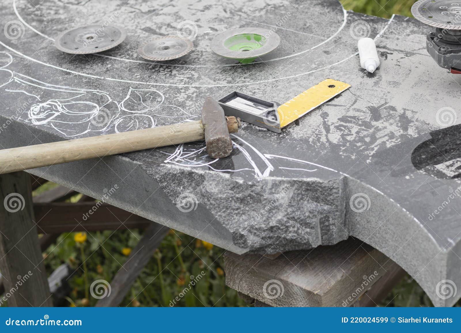 Street Lighting. a Masked Worker Processes a Granite Stone with a ...