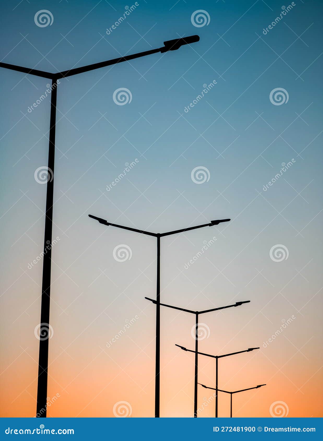 Street Lights on Highway Against the Backdrop of the Sunset Sky Stock ...