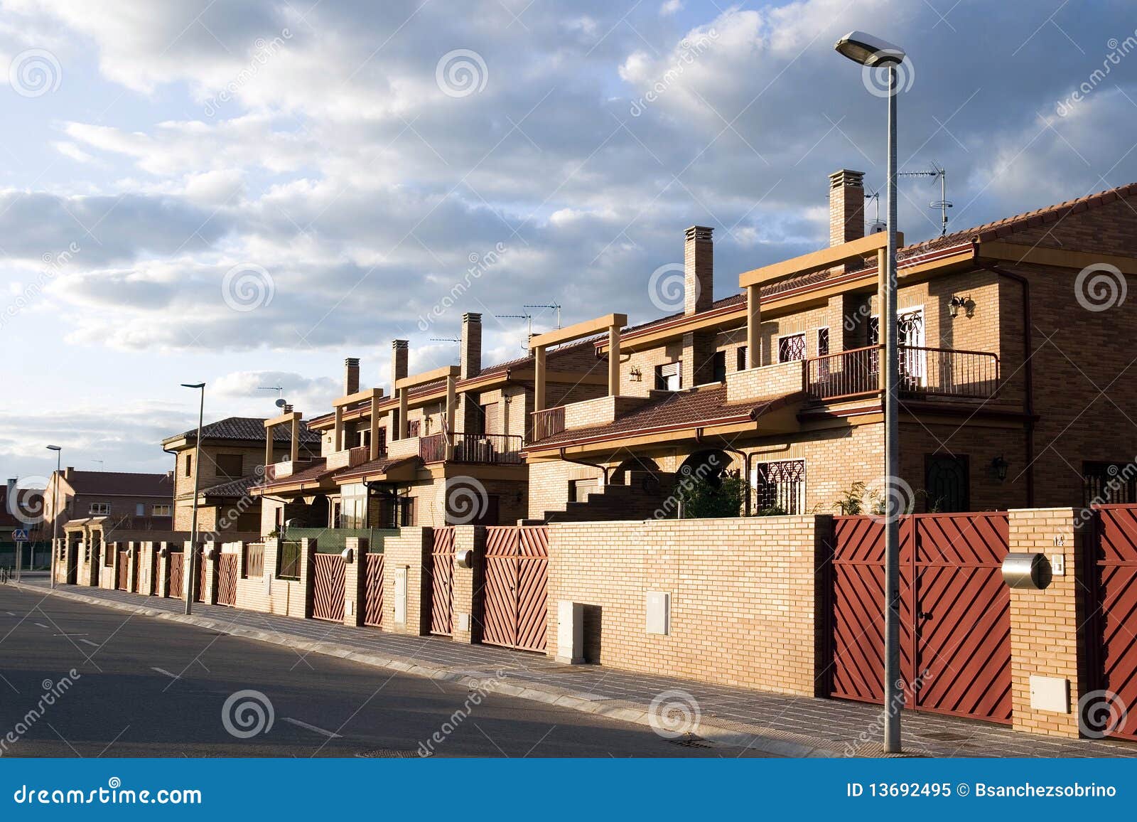 Street of modern houses stock image. Image of roadway - 13692495