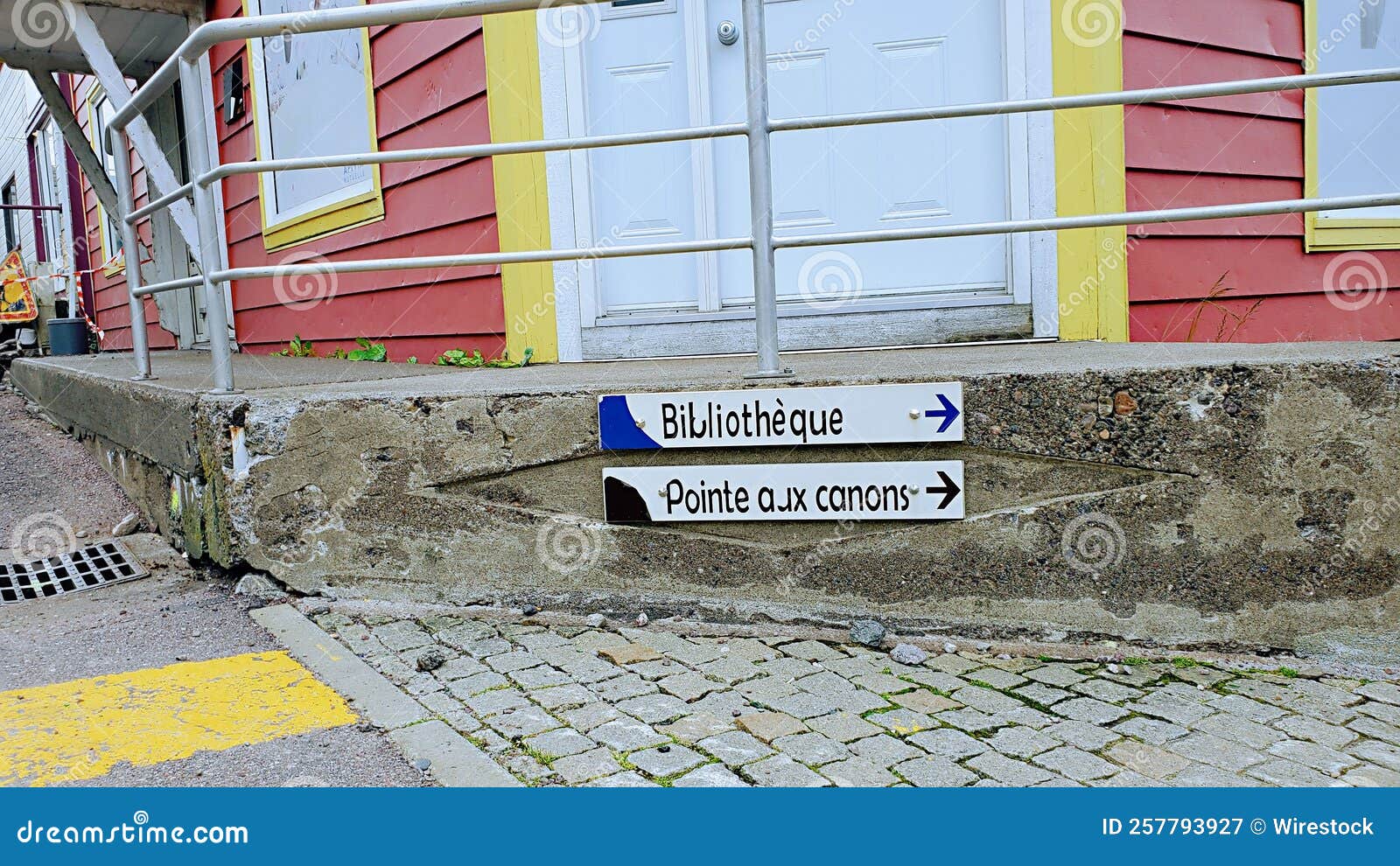 Street Signs in Front of a Building Below Stock Image - Image of ...