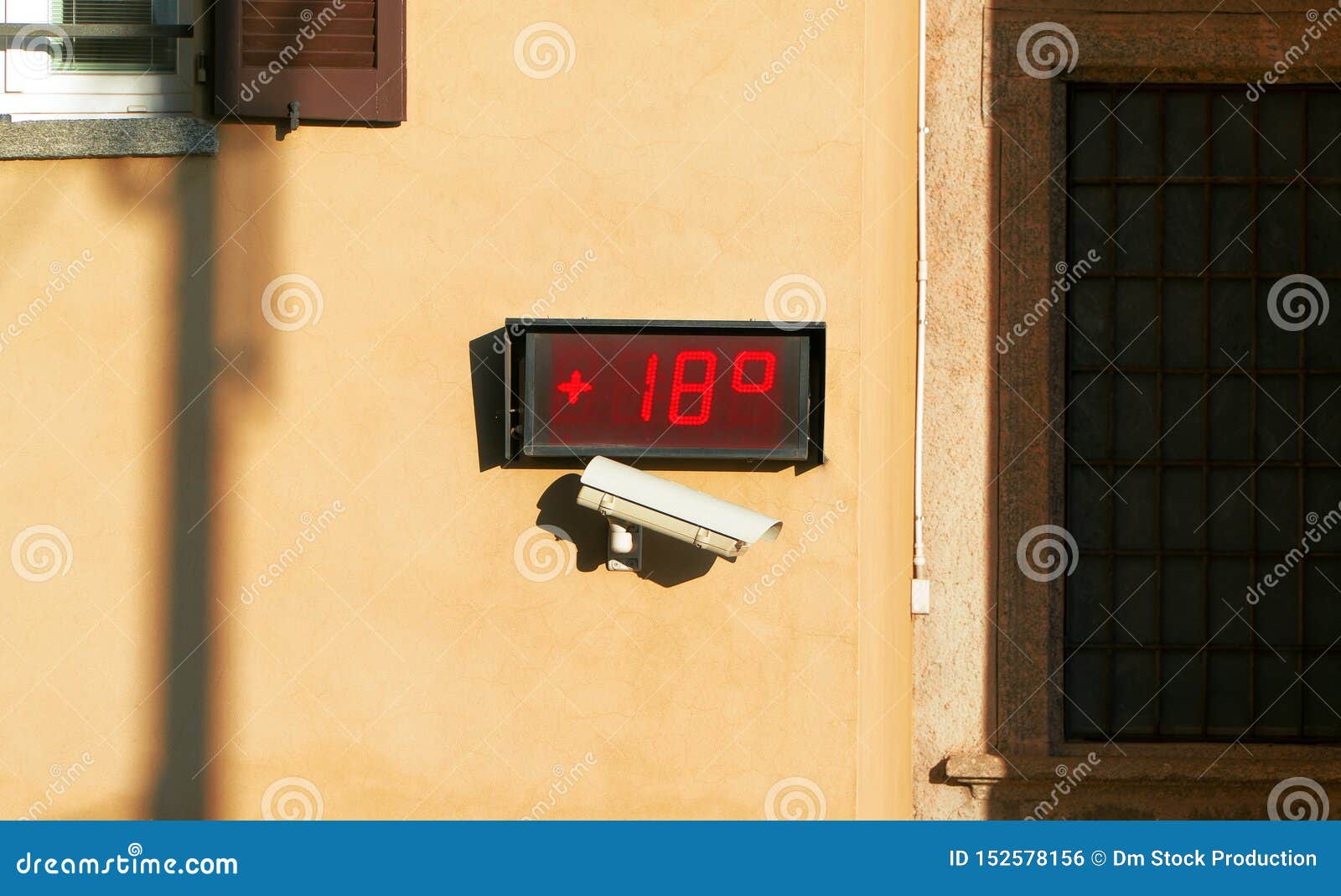 Street Thermometer Displaying Temperature of 18 Degrees. Stock Photo ...