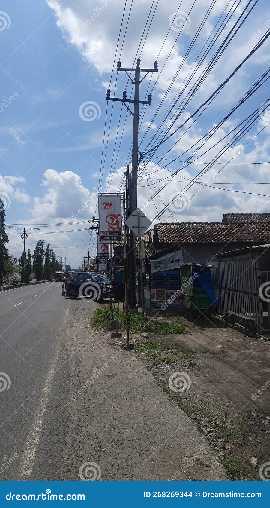 The Street Under the Sun with Cable, Sand and Buildings Editorial Stock ...