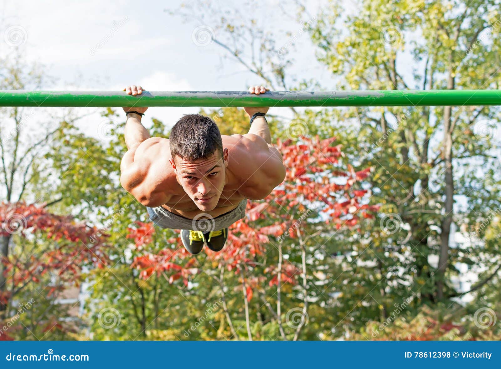 Street Workout. Athlete Man during His Workout in the Park. Stock Photo ...