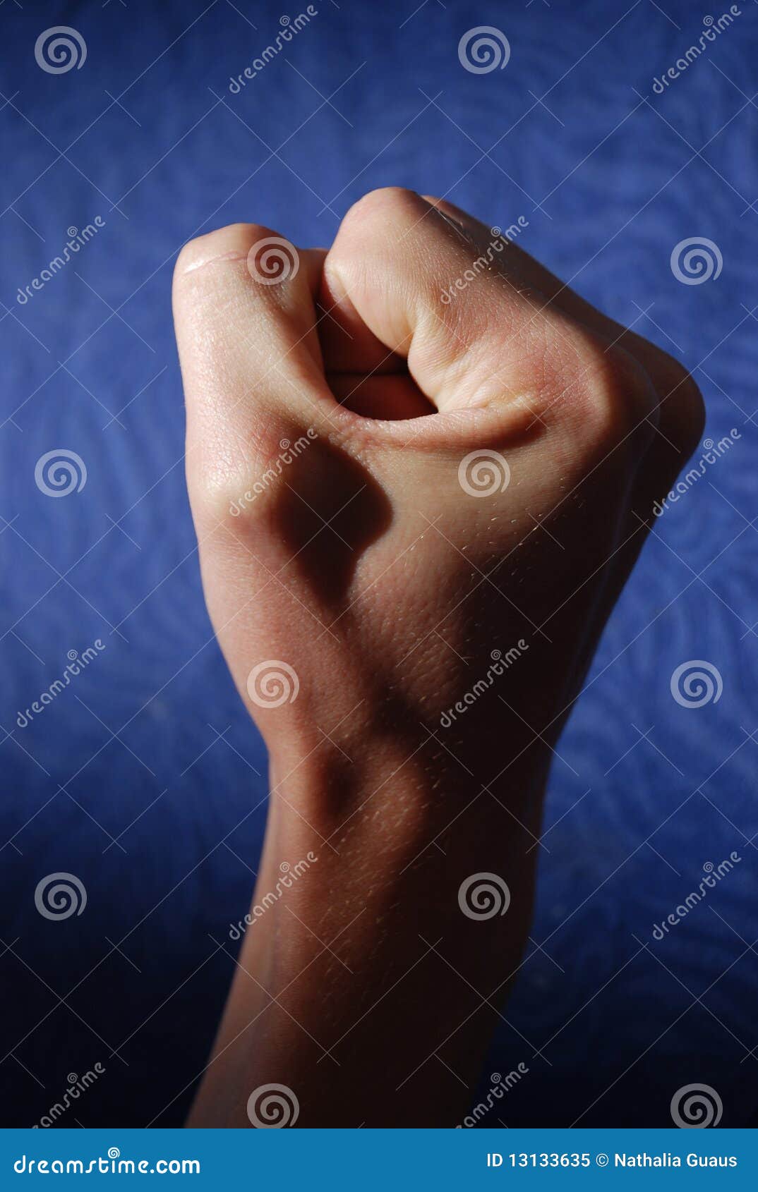 Strenght stock image. Image of blue, fist, shadows, hand - 13133635