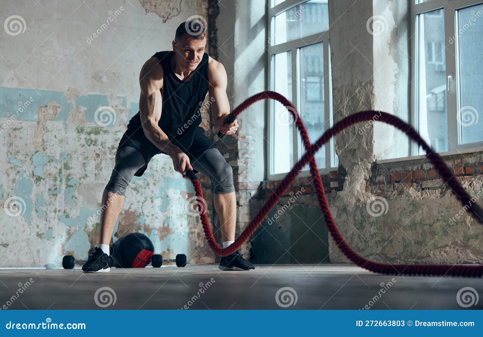 Strength and Endurance. Young Muscular Man Doing Workout, Training with ...