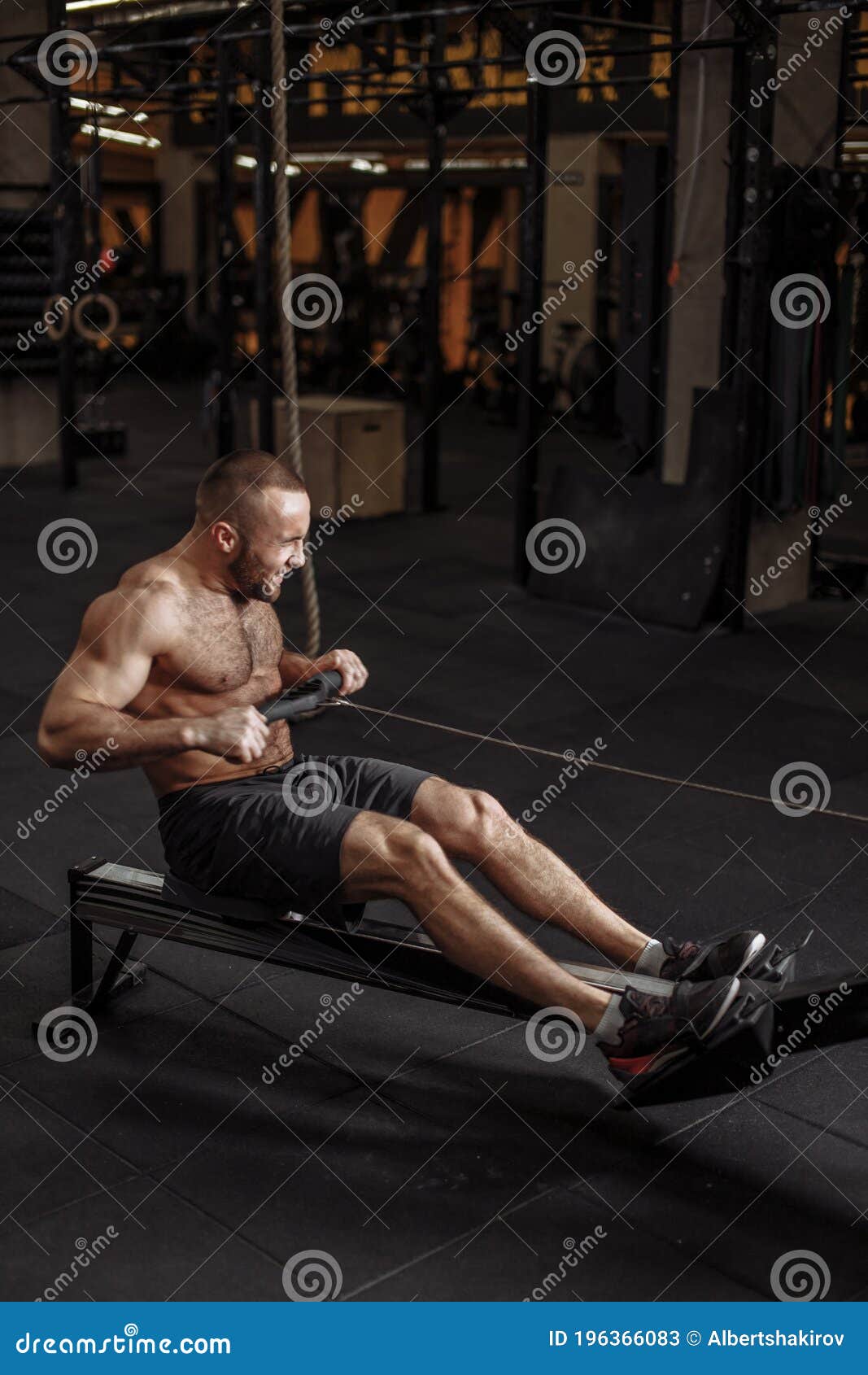 Strength , Power and Force Concept. Intense Exercise on Rowing Machine ...