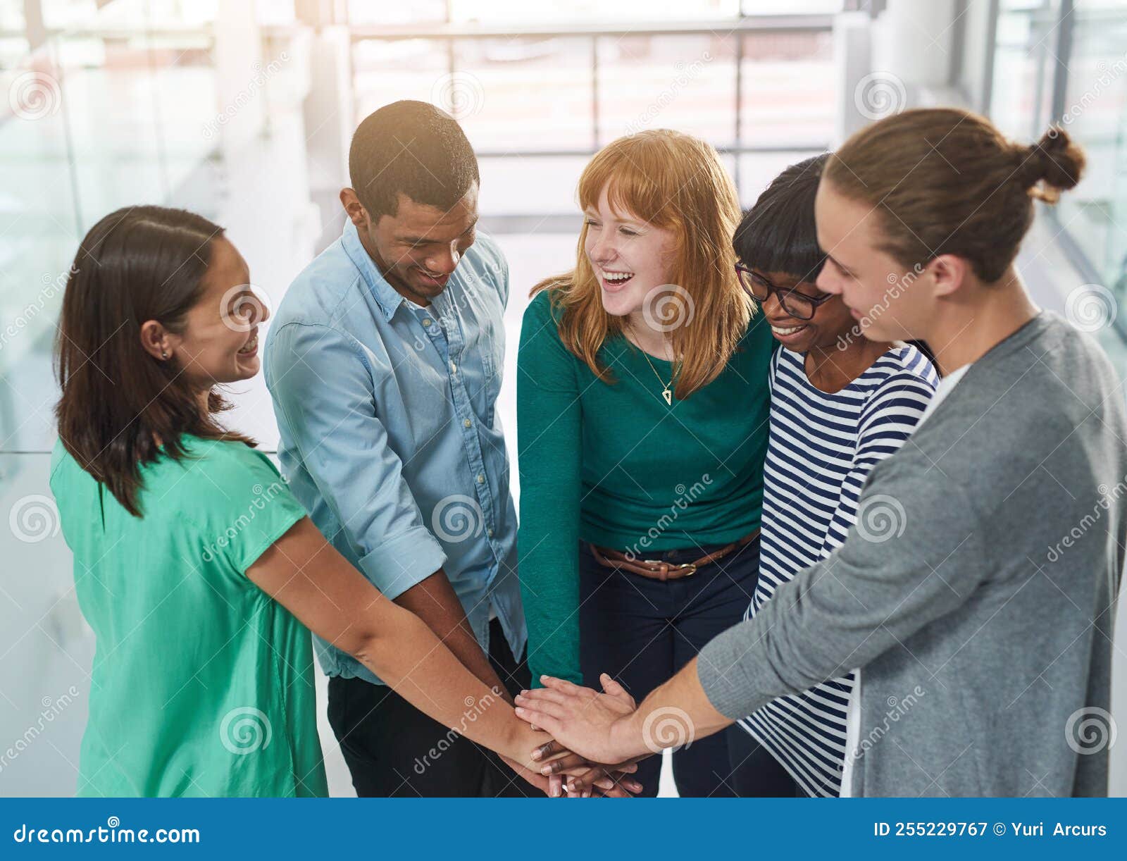 The Strength of a Team. a Group of People Putting Their Hands Together ...