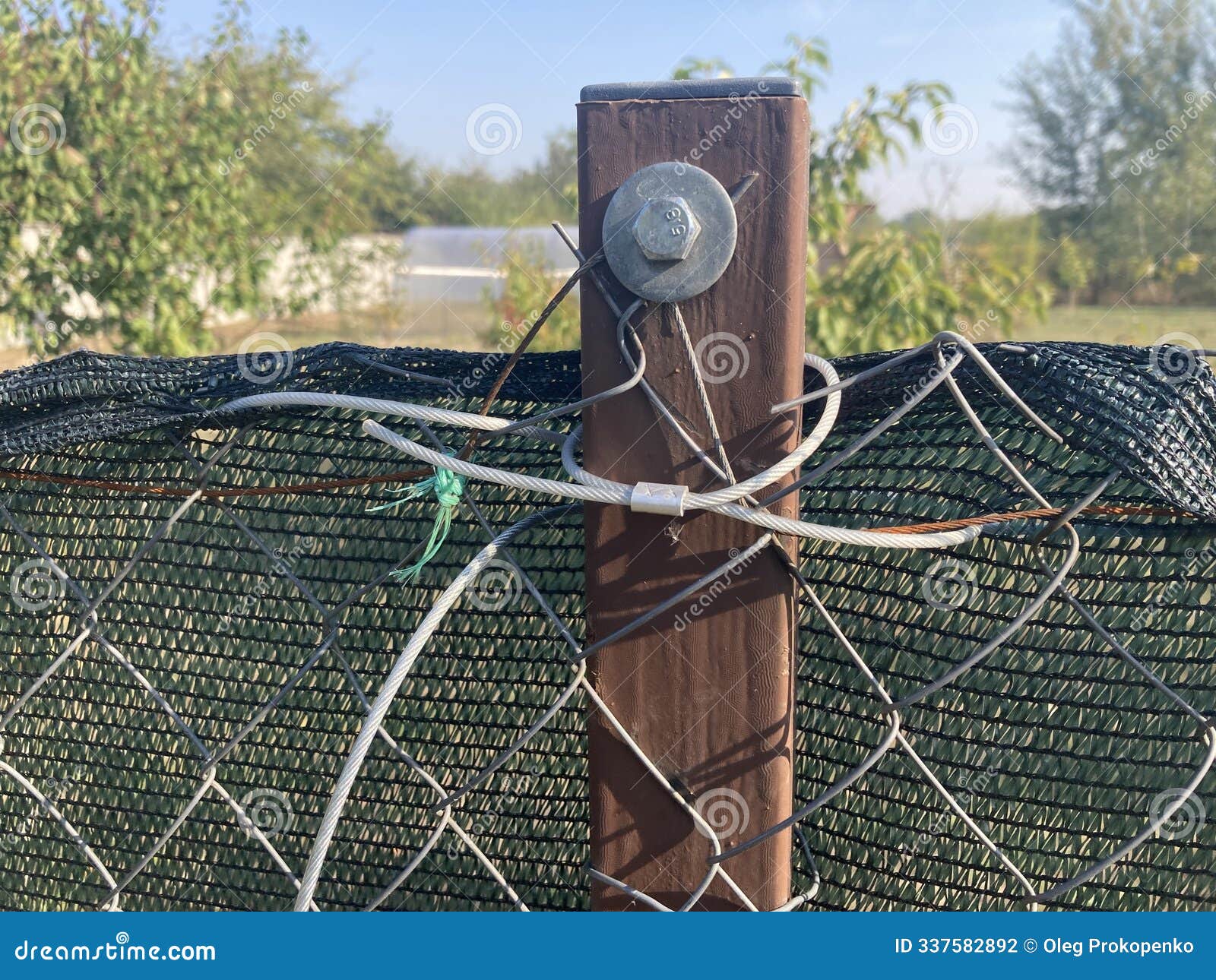 Strengthening the Fence with a Rope and Wire Stock Photo - Image of ...