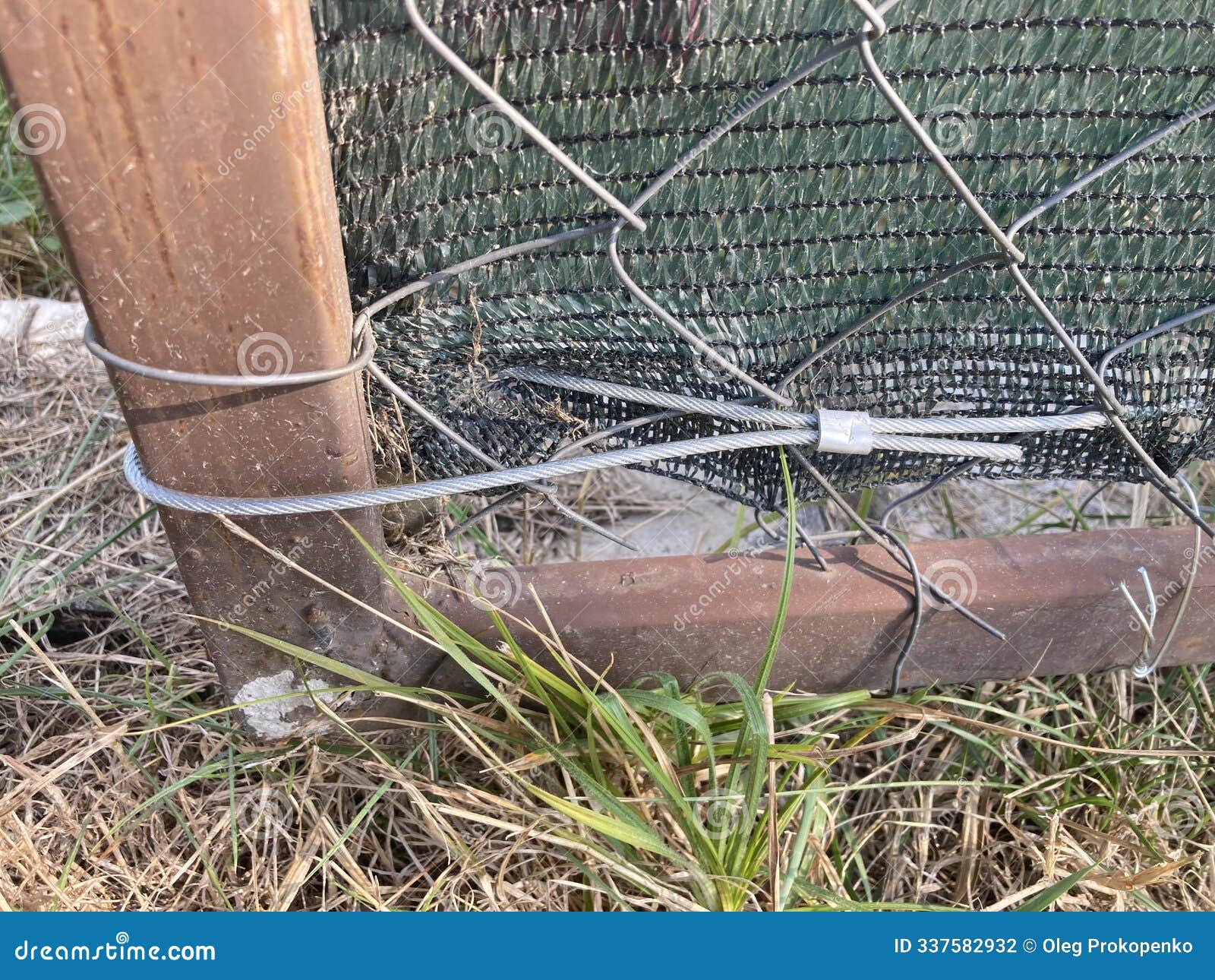 Strengthening the Fence with a Rope and Wire Stock Photo - Image of ...