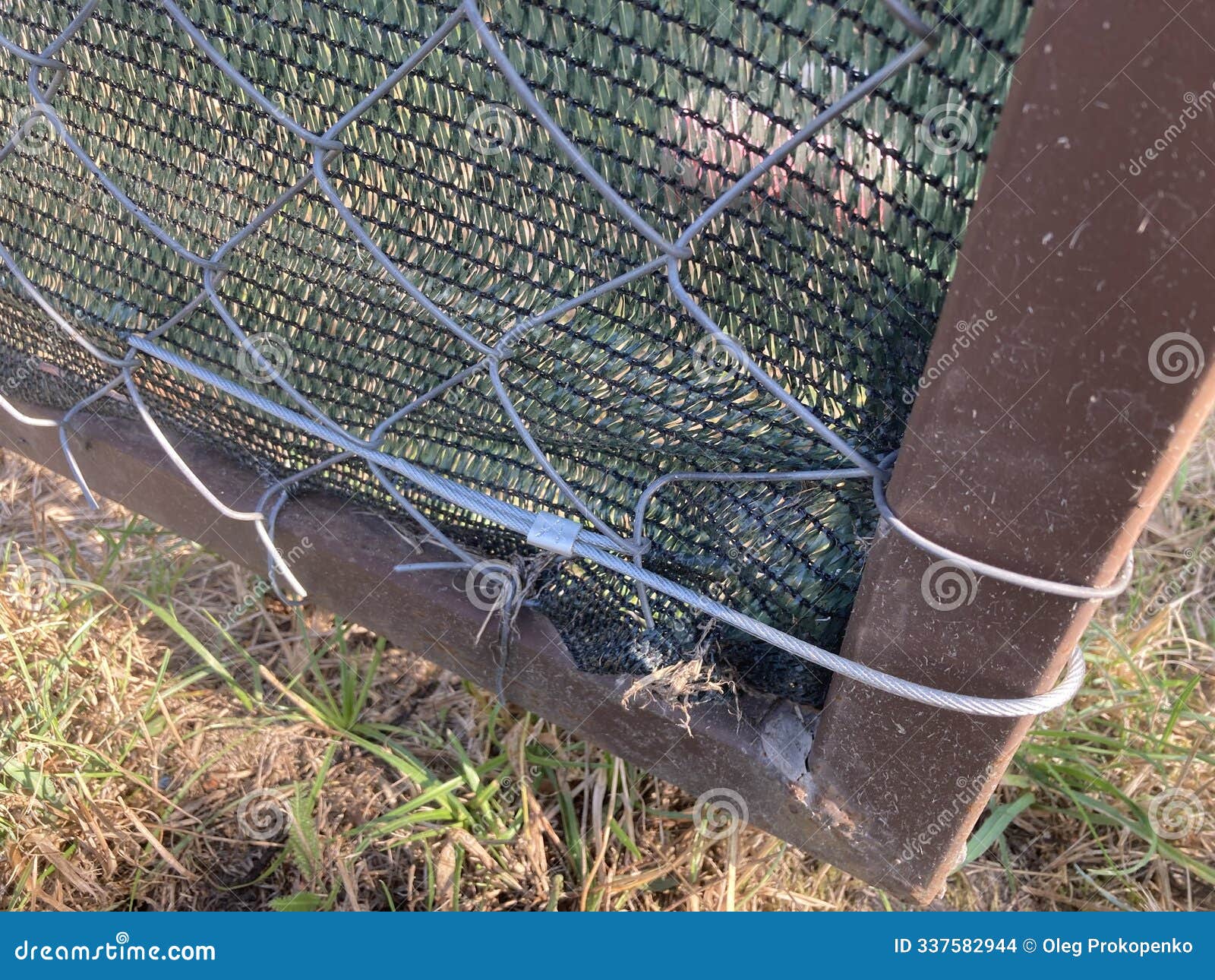 Strengthening the Fence with a Rope and Wire Stock Photo - Image of ...