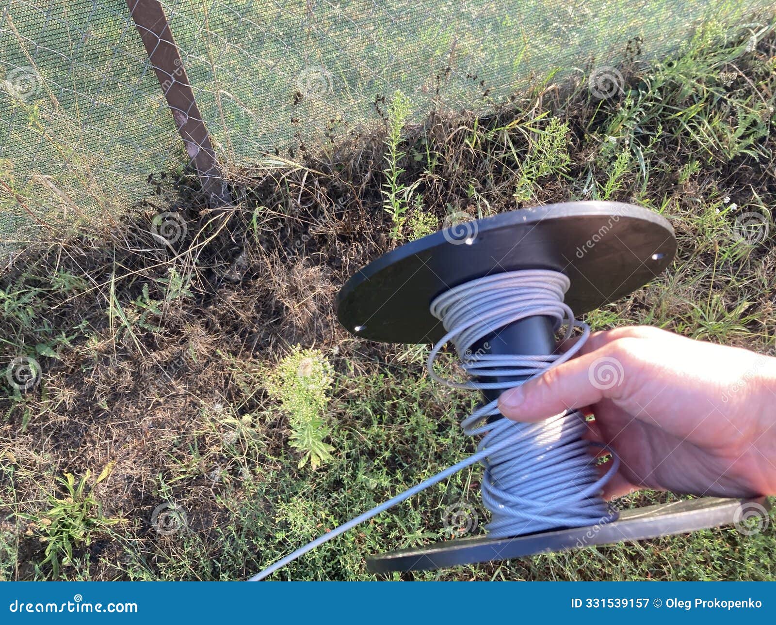 Strengthening a Fence with a Shading Net with a Rope Stock Image ...