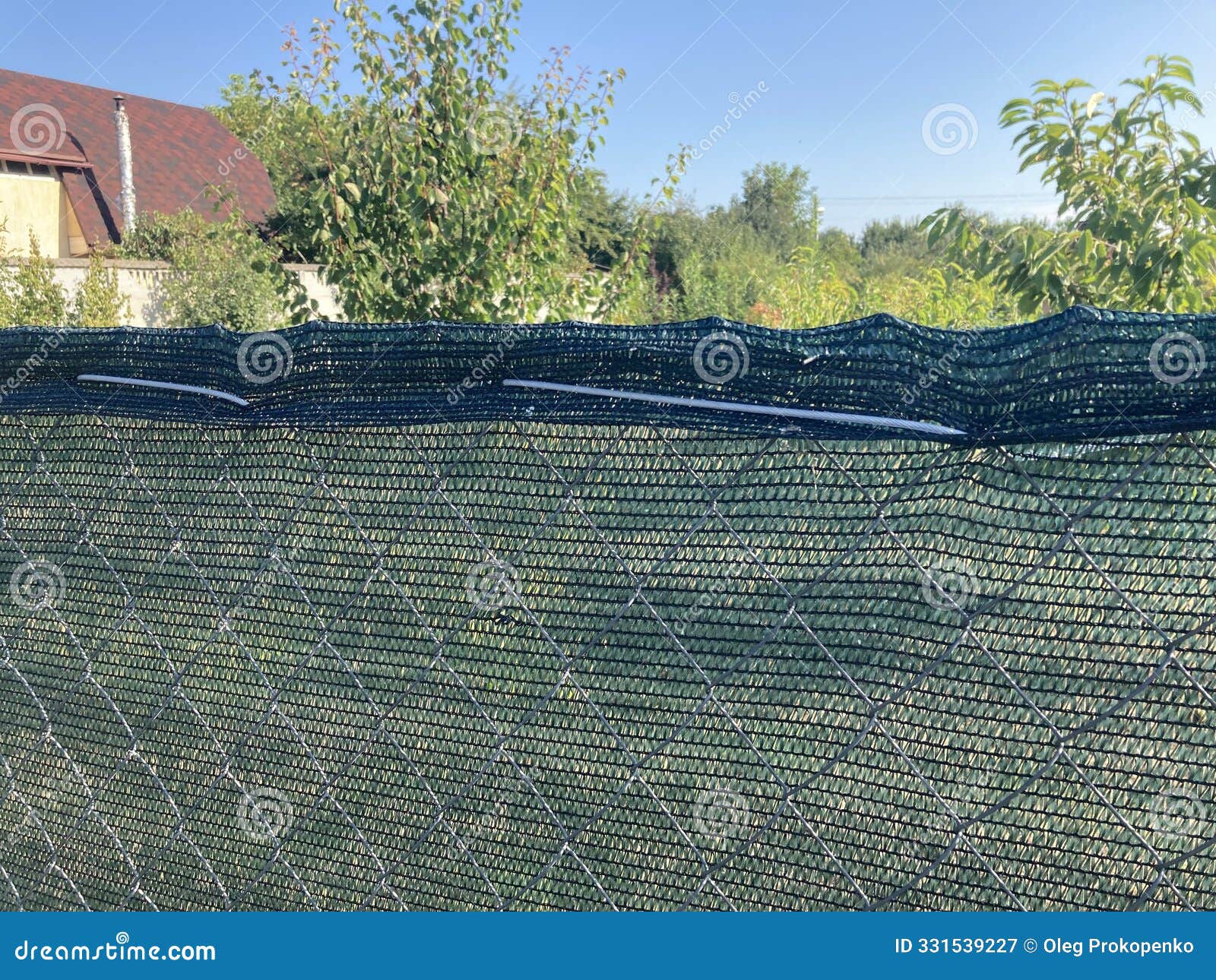 Strengthening a Fence with a Shading Net with a Rope Stock Image ...