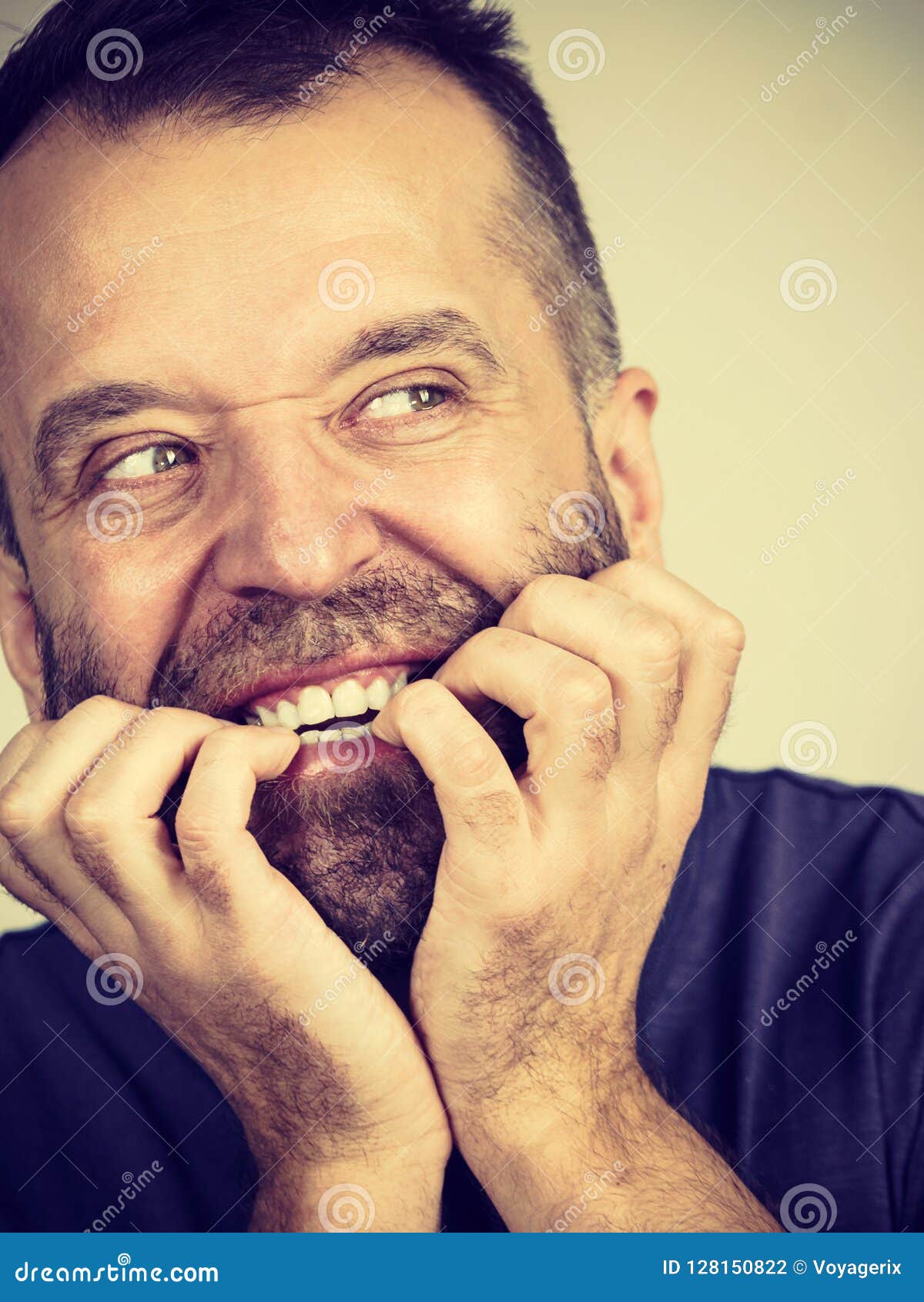 Man biting his nails stock photo. Image of studio, anxiety - 128150822