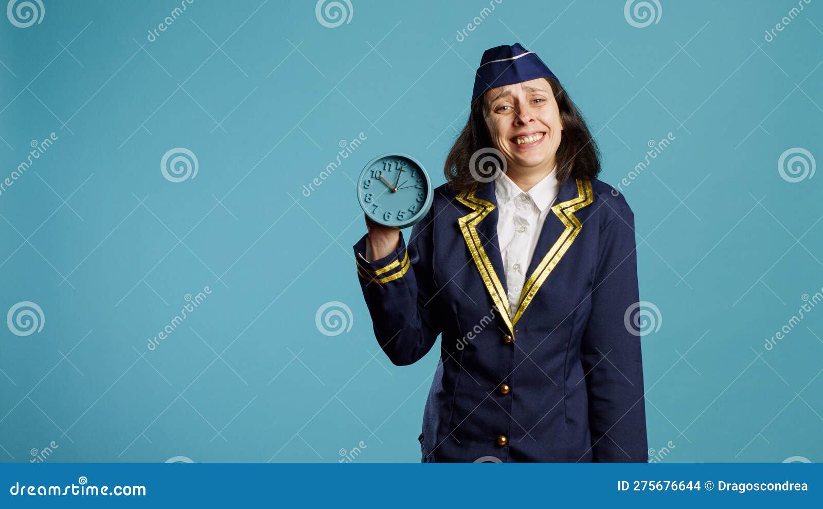 Stressed Air Hostess Checking Time on Clock in Studio Stock Photo ...