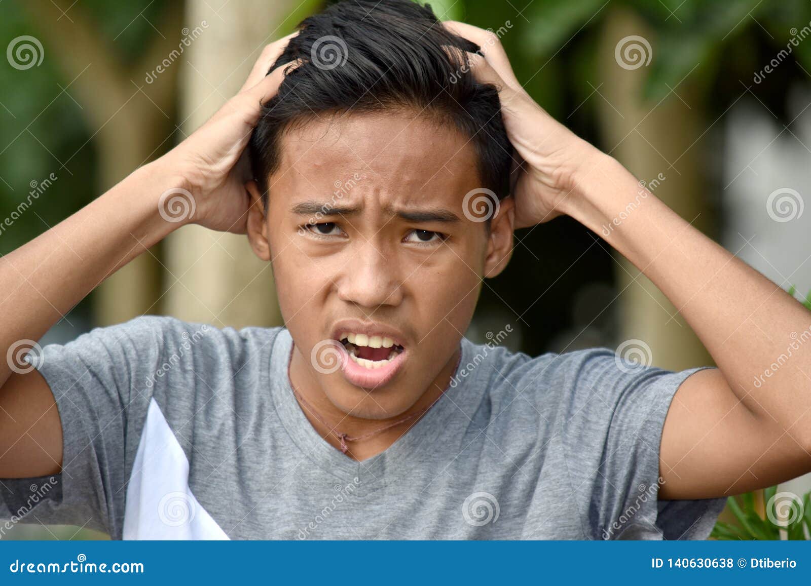 A Stressed Asian Boy stock photo. Image of stressful - 140630638