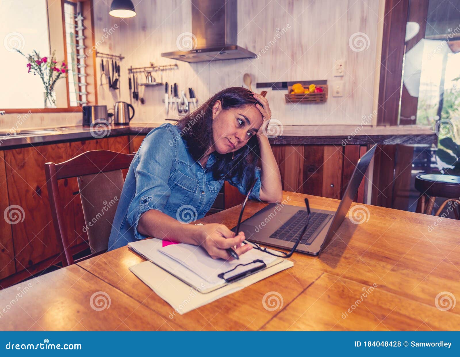 Attractive Young Business Woman Working From Home On Her Computer