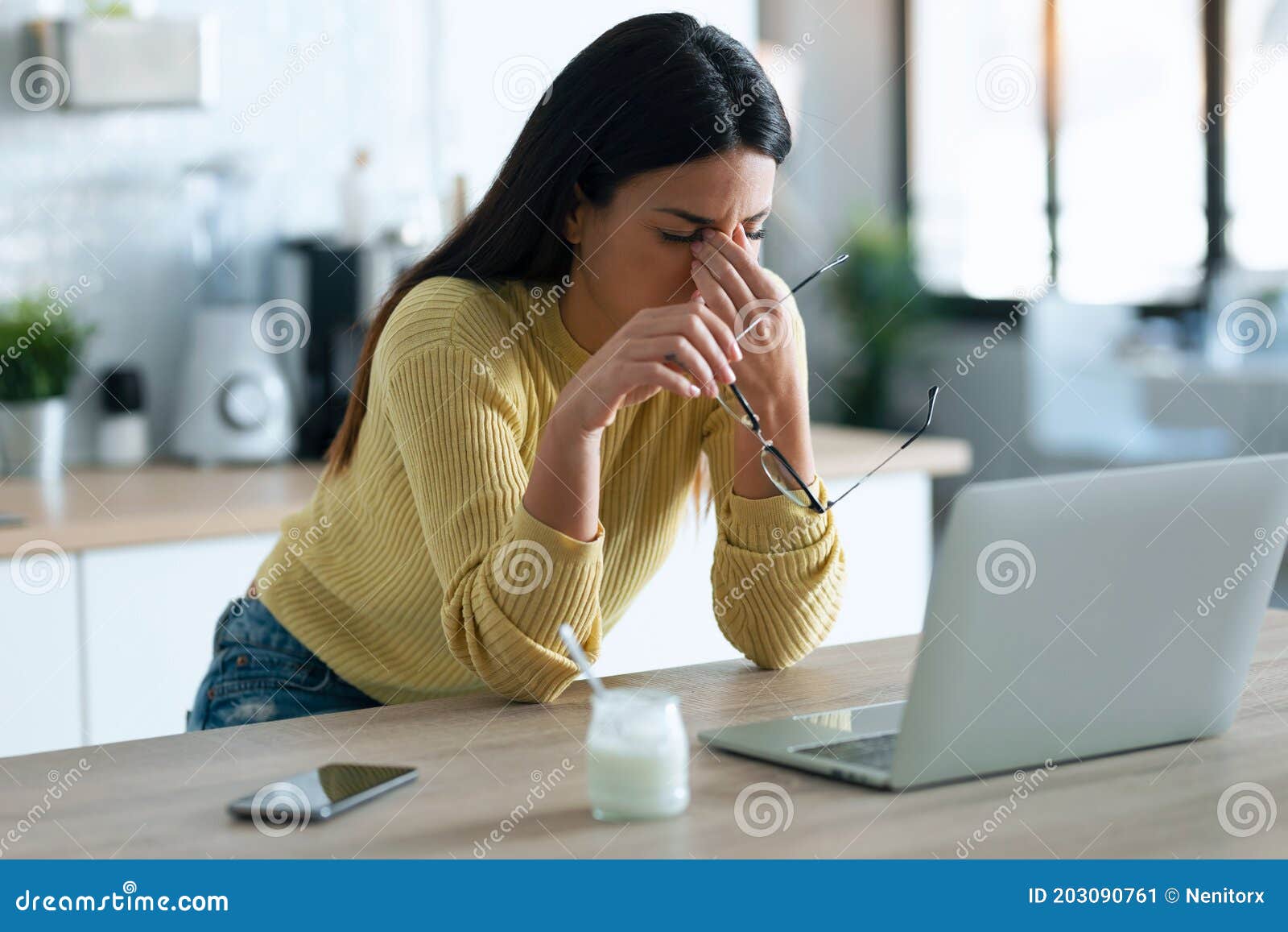 Stressed Business Woman Working From Home On Laptop Looking Worried