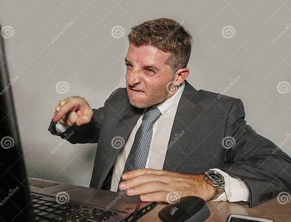 Stressed Businessman In Suit And Tie Working Angry At Office Laptop