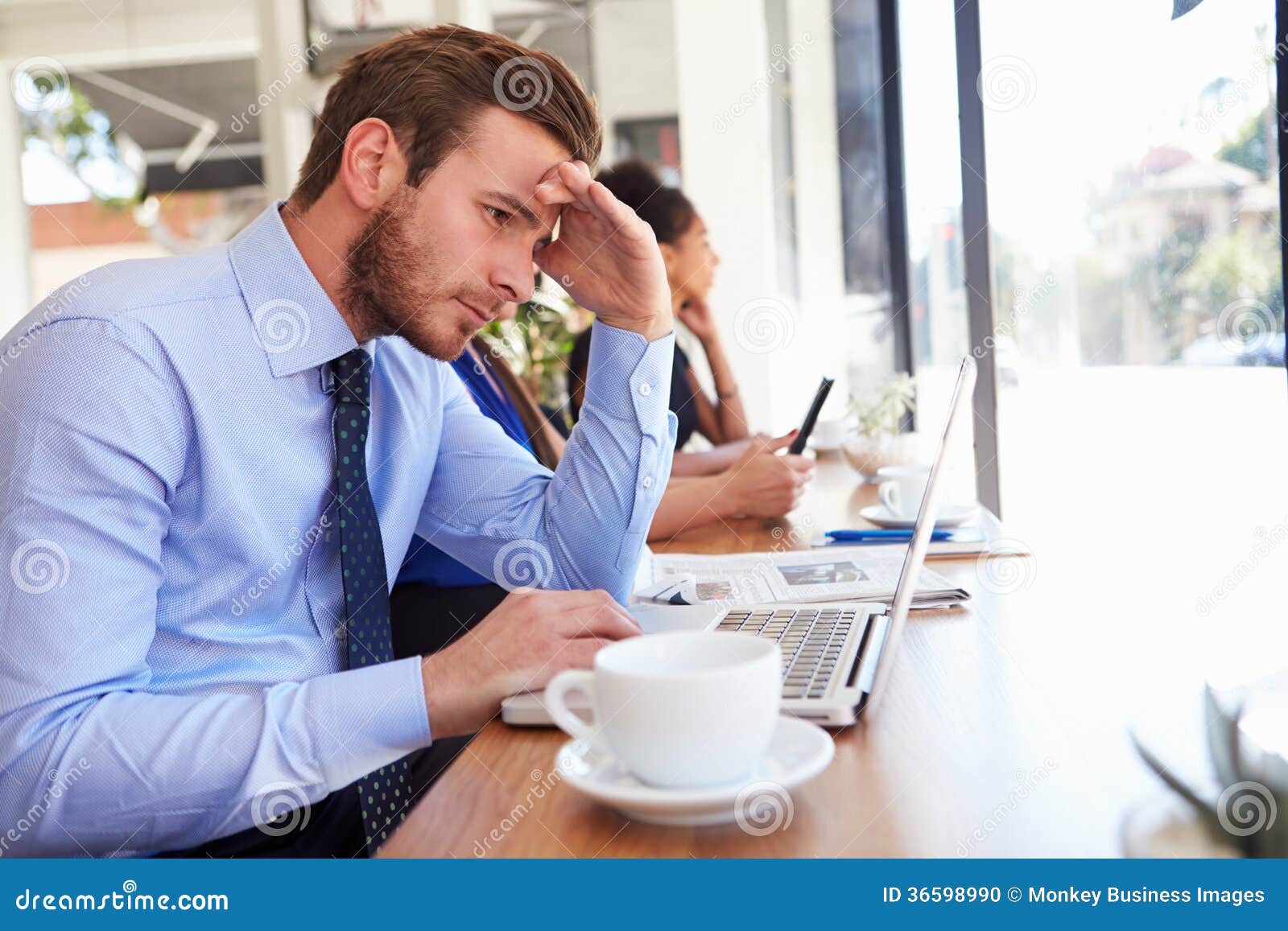 Stressed Businessman Using Laptop in Coffee Shop Stock Photo - Image of ...