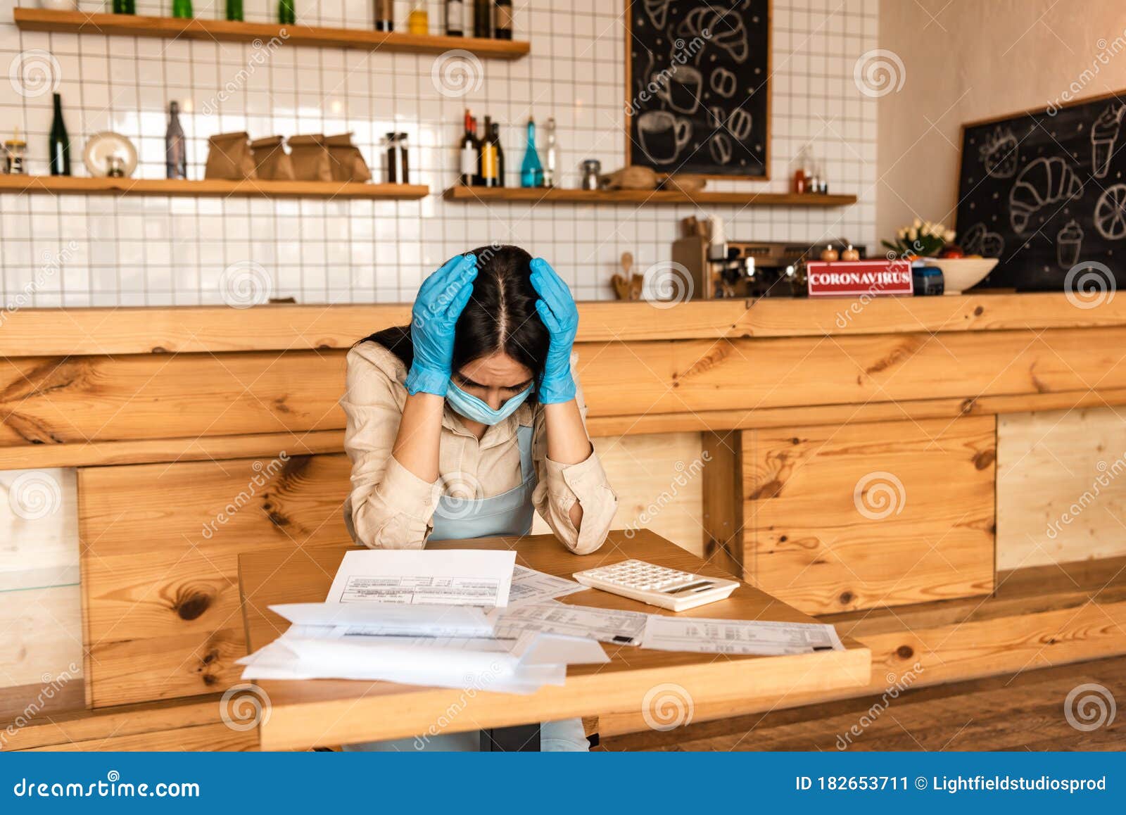 Stressed Cafe Owner in Latex Gloves Touching Head Near Documents and ...