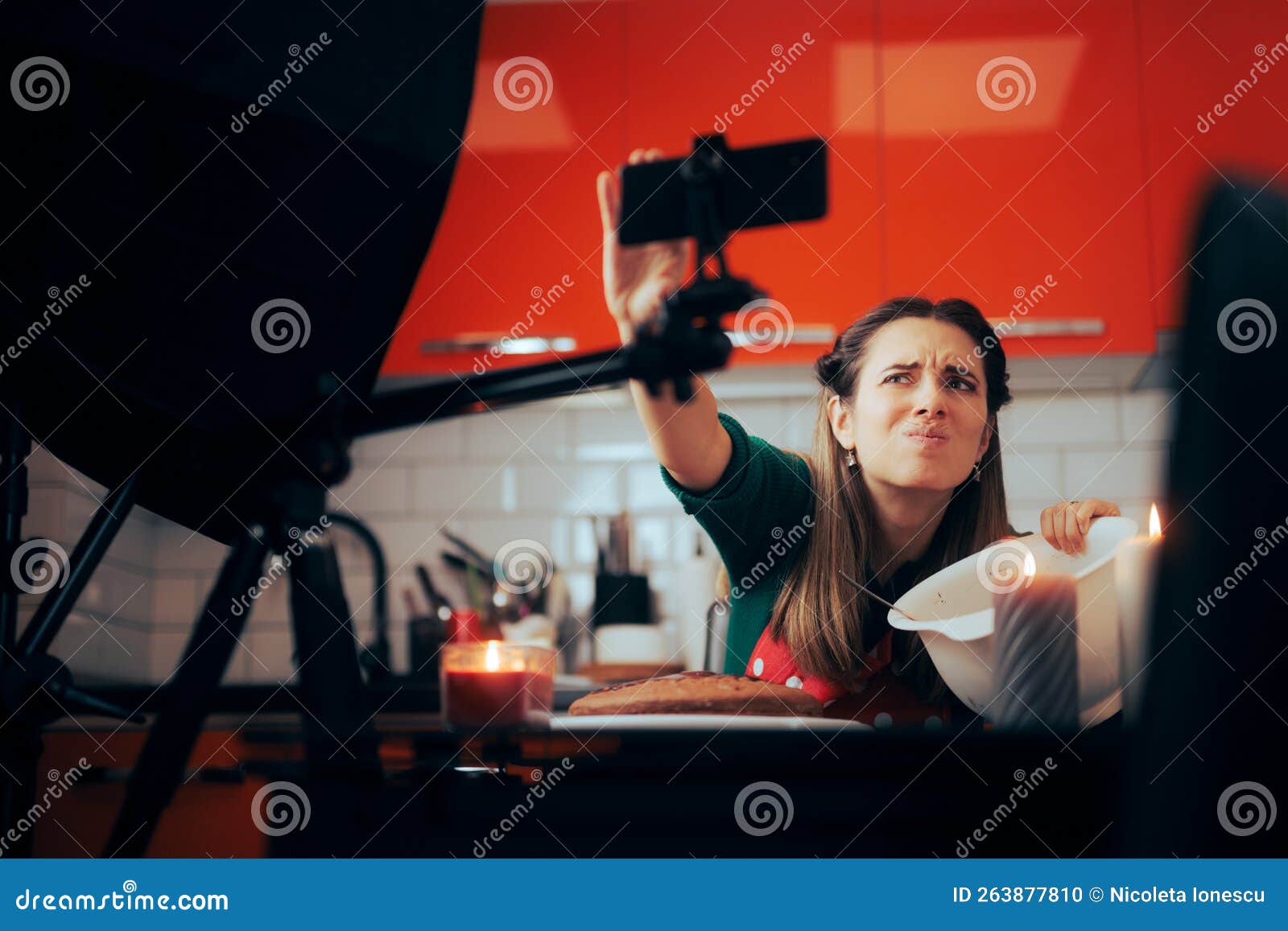 Chef Vlogger Fixing Her Phone Filming a Cooking Tutorial Stock Photo ...