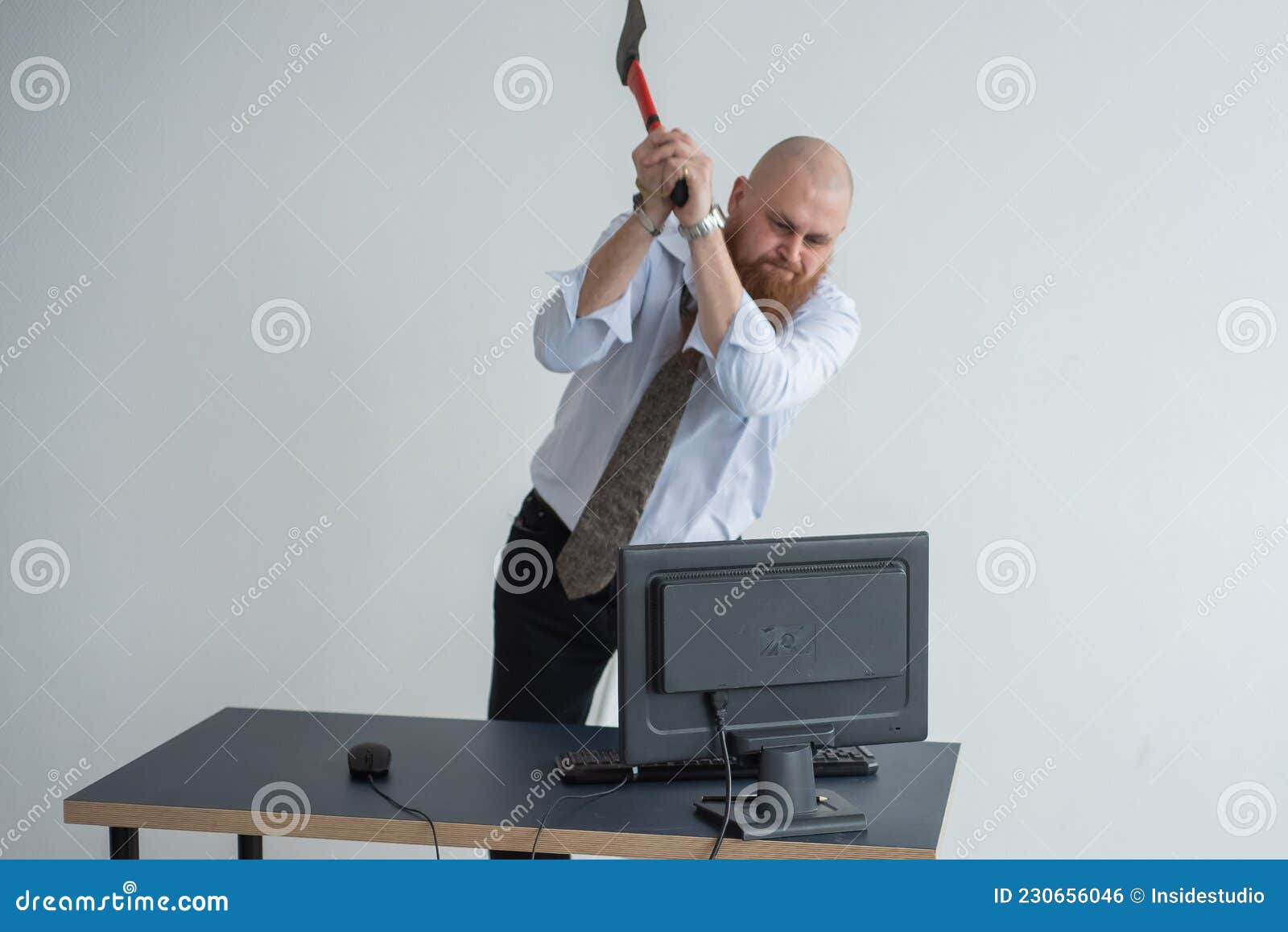 Stressed Crazy Businessman Smashing His Computer in Office Using Ax ...