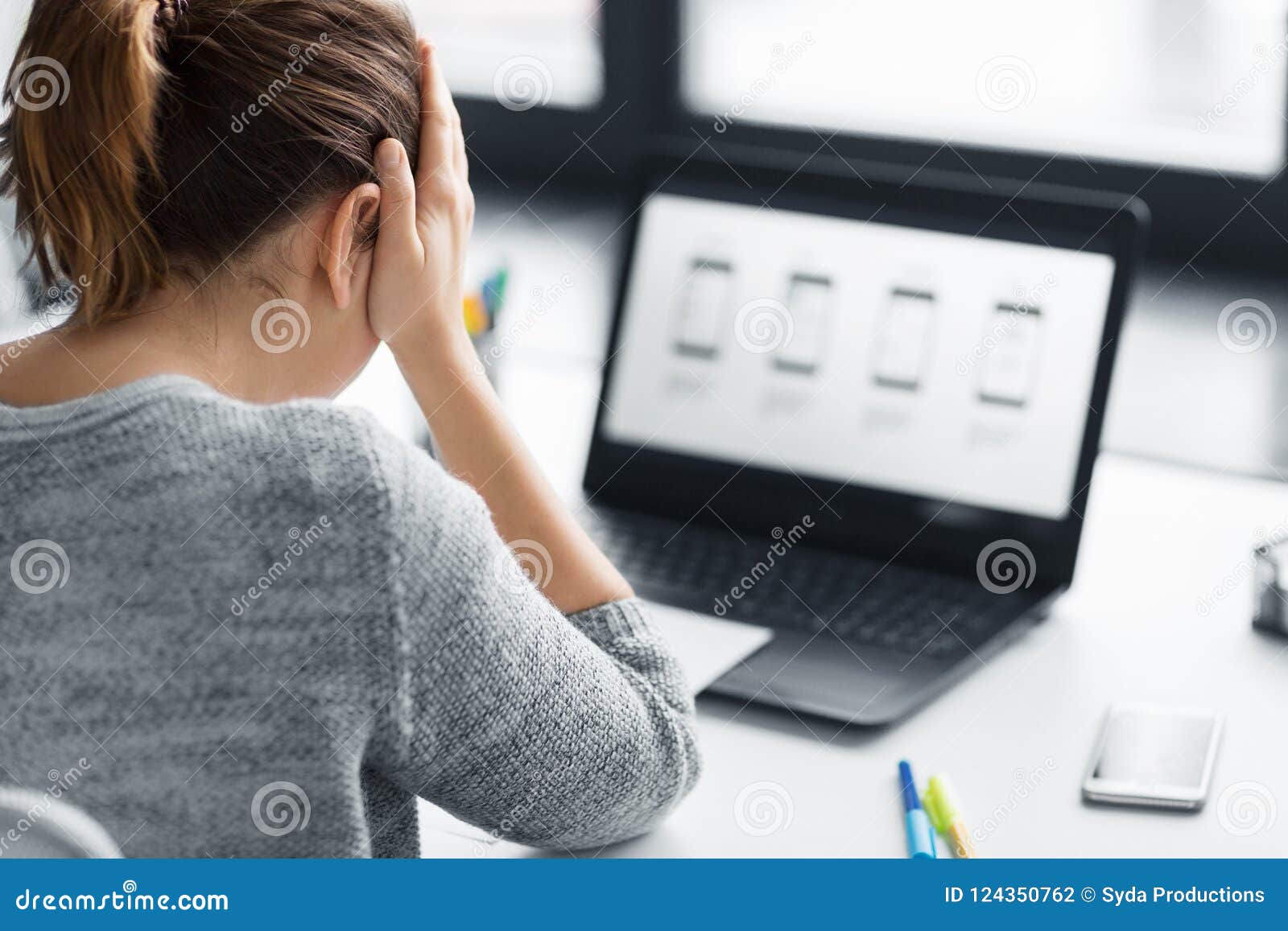 Stressed Designer with User Interface on Laptop Stock Photo - Image of ...