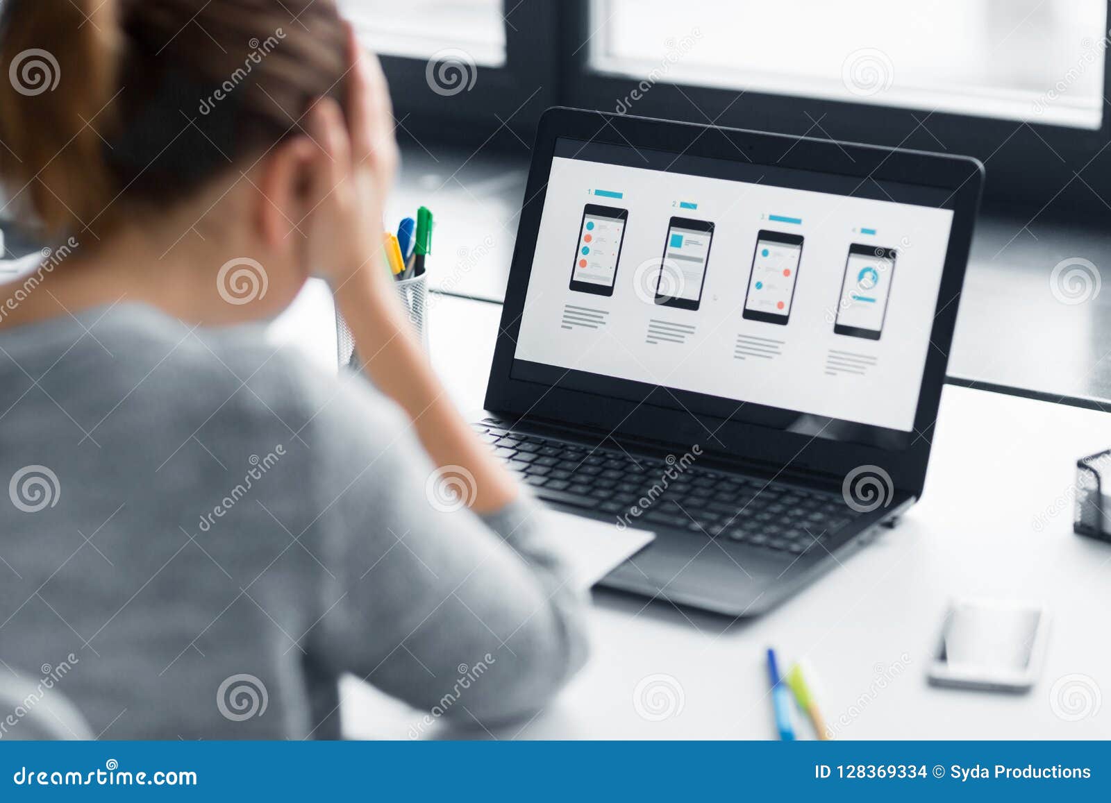 Stressed Designer with User Interface on Laptop Stock Photo - Image of ...