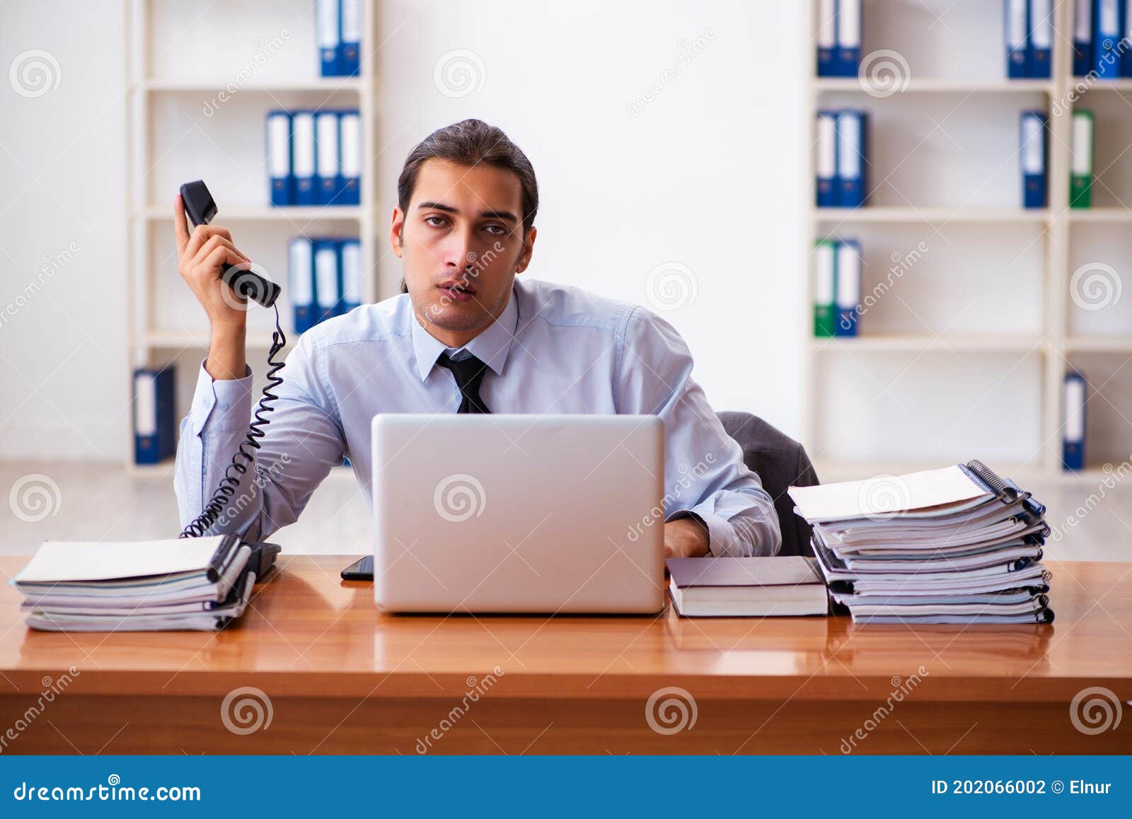 Stressed Male Employee Working in the Office Stock Photo - Image of ... Stressed Male Employee Working in the Office Stock Photo - Image of ...