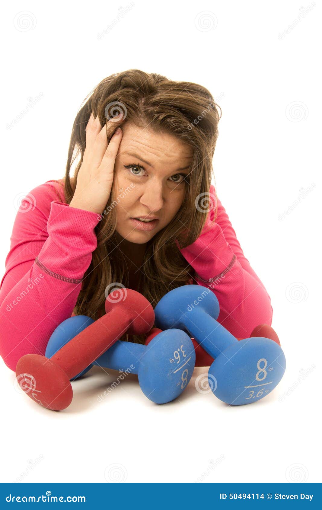 Stressed Female Model Laying Down by Barbell Weights Stock Photo ...