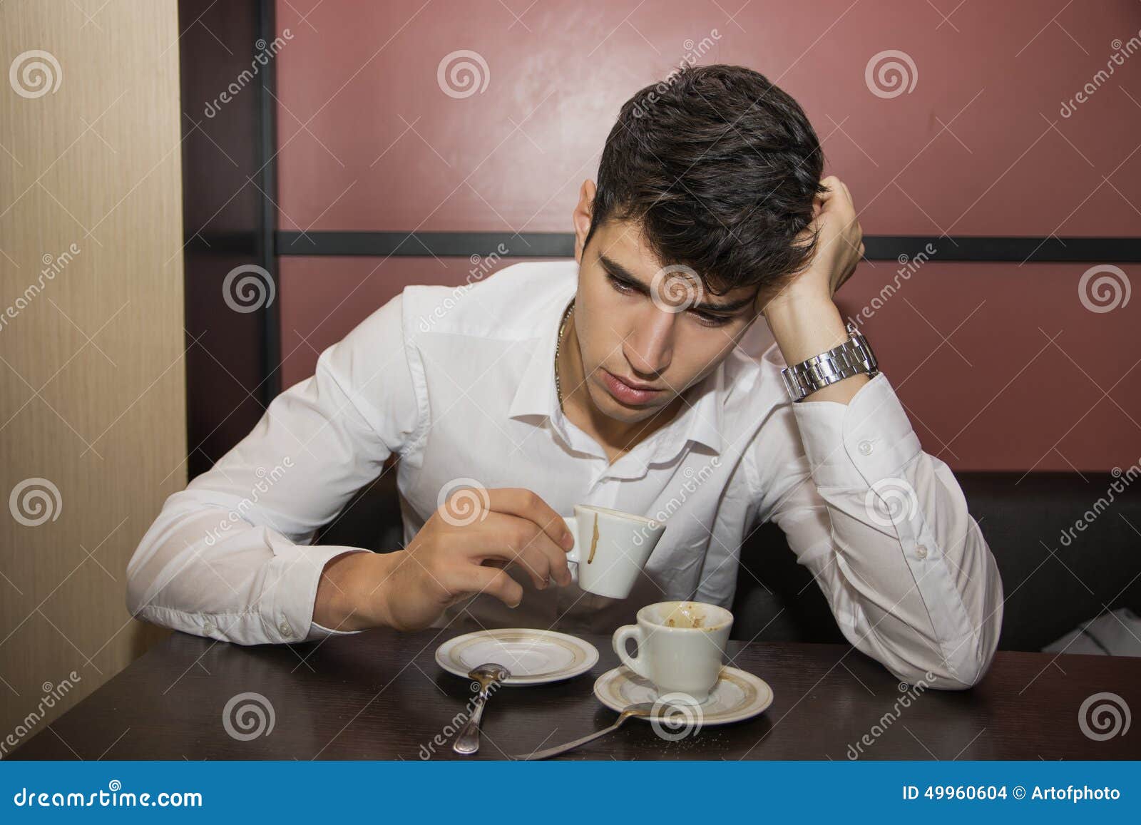Stressed Handsome Man Having a Cup of Coffee at the Cafe Stock Photo ...