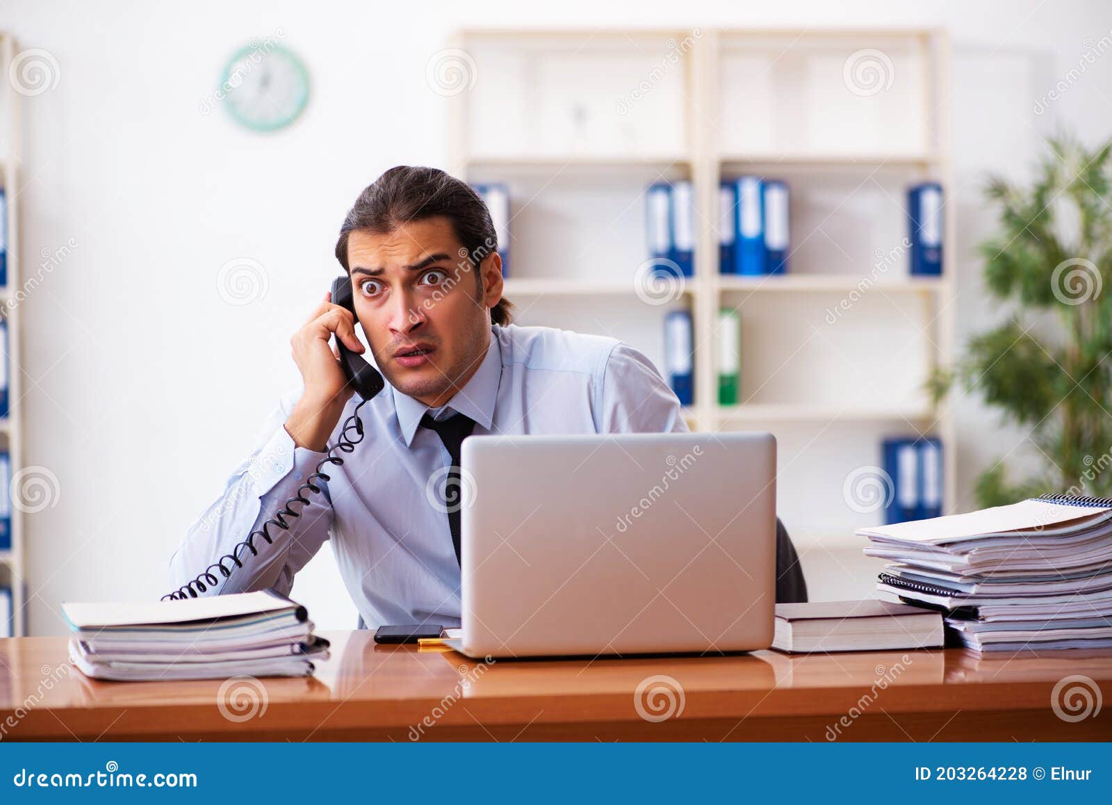 Stressed Male Employee Working in the Office Stock Photo - Image of ... Stressed Male Employee Working in the Office Stock Photo - Image of ...