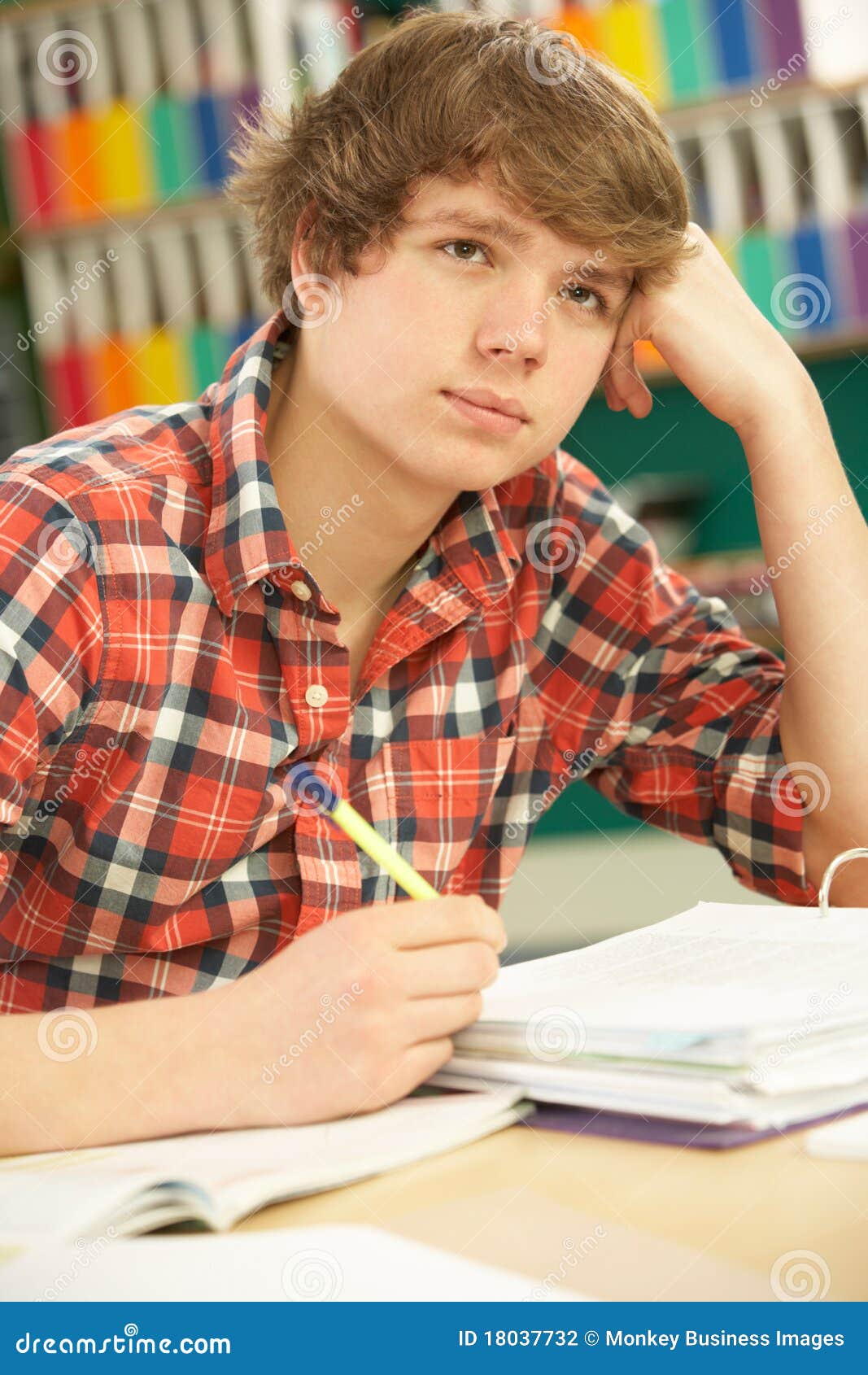 Stressed Male Teenage Student Studying Stock Photo - Image of sitting ...