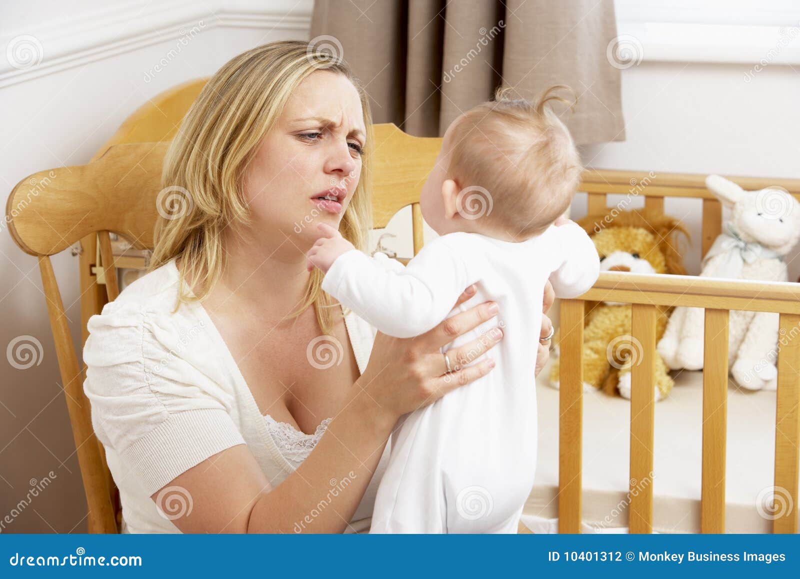 Stressed Mother Holding Baby in Nursery Stock Photo - Image of woman ...