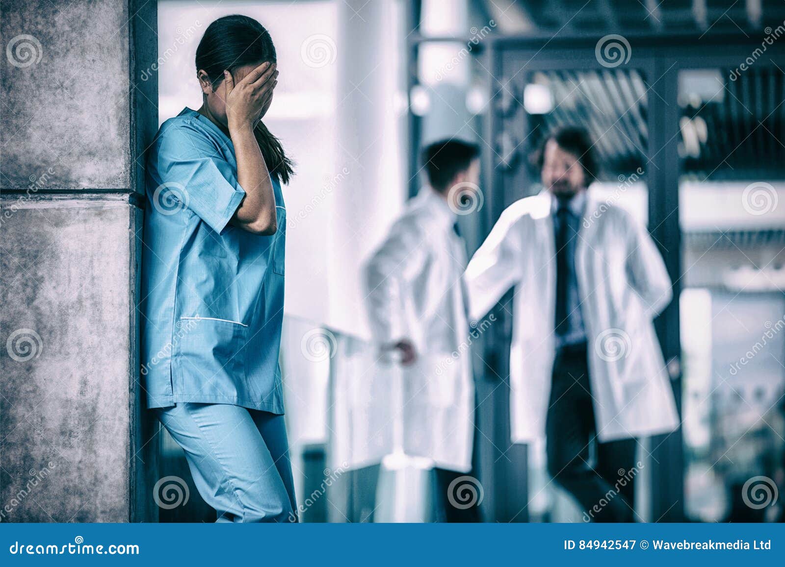 Stressed Nurse Standing in Hospital Stock Image - Image of attractive ...