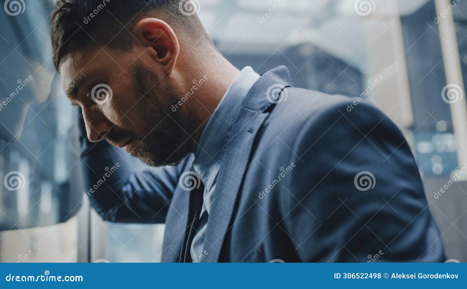 Stressed Out Manager Going Down from Office in a Glass Elevator in ...