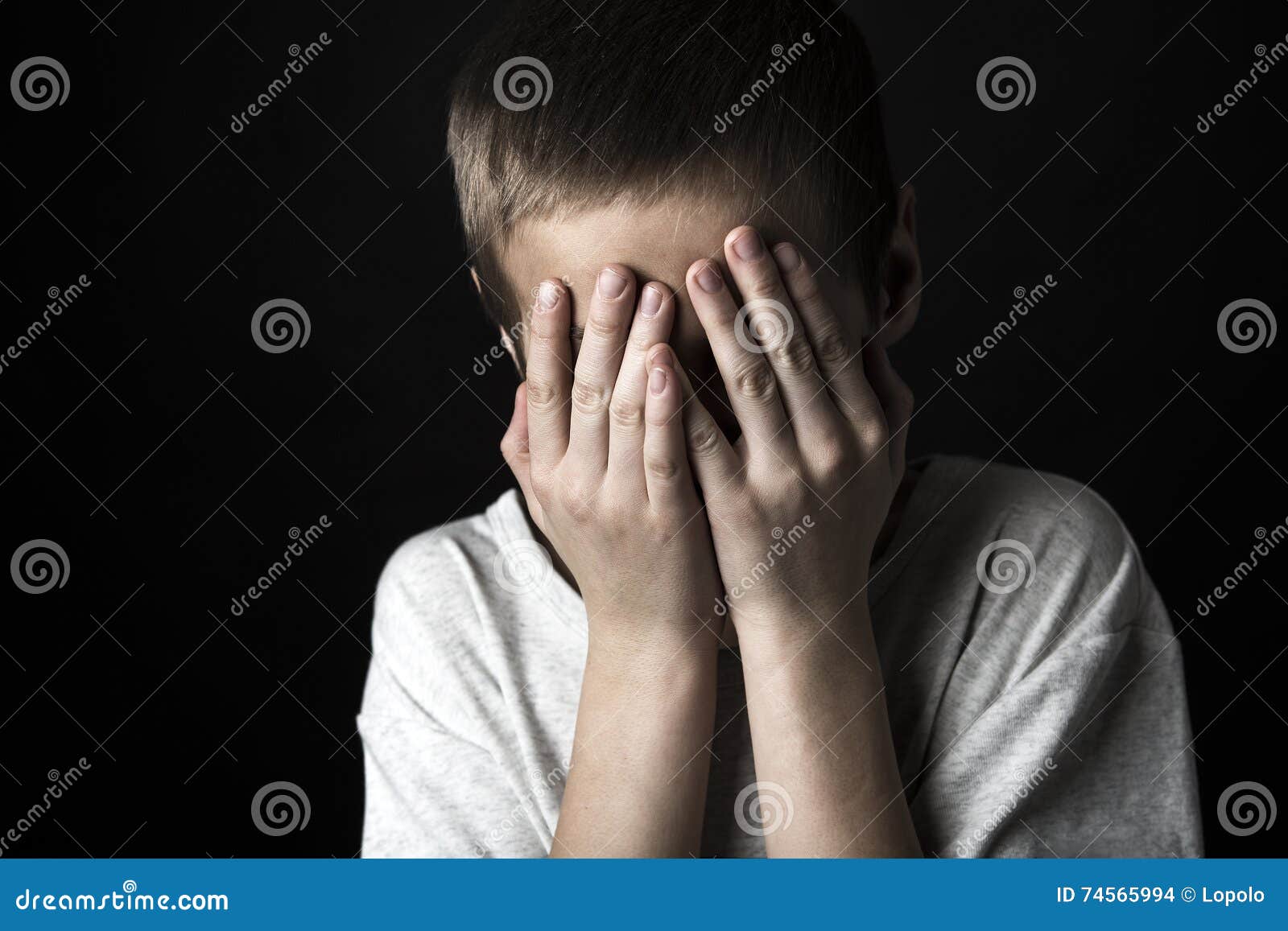 Stressed sad boy on studio stock photo. Image of crying - 74565994