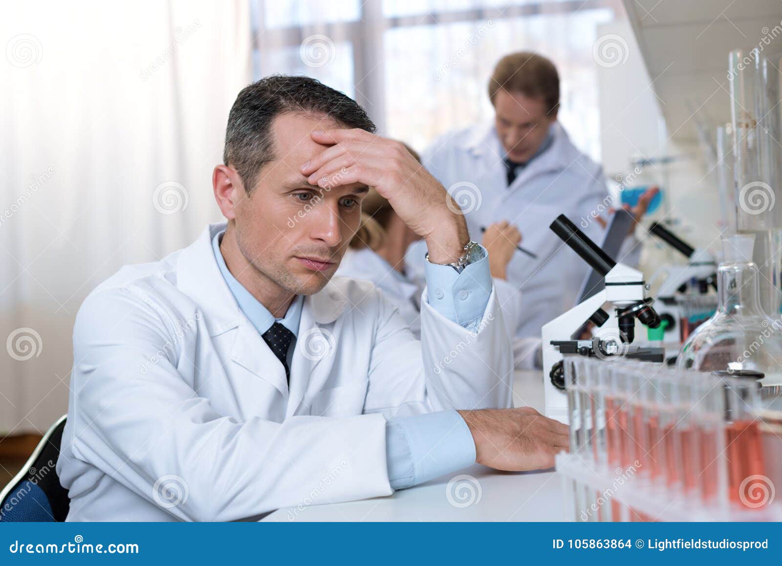 Stressed scientist in lab stock photo. Image of chemistry - 105863864