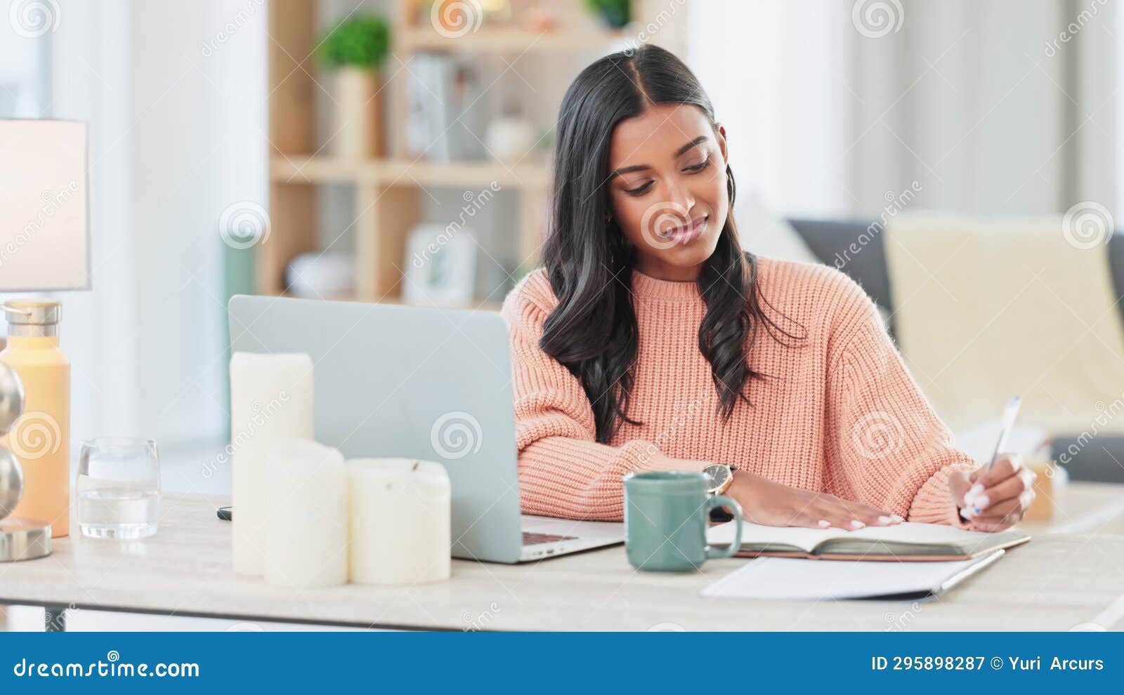 Stressed Student Studying on Laptop, Writing Notes in Book and ...