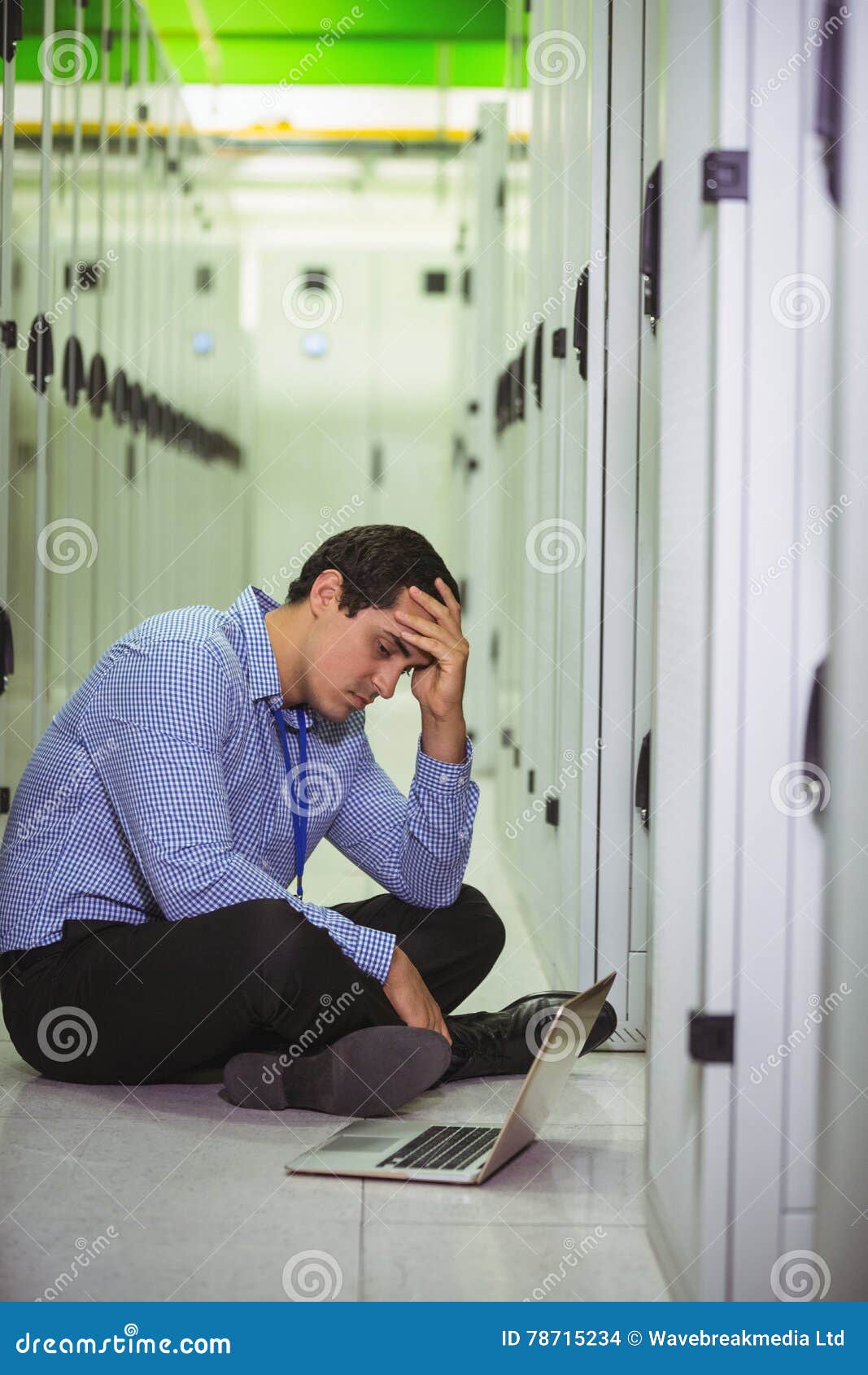 Stressed Technician Sitting on Floor and Looking at Laptop Stock Photo ...