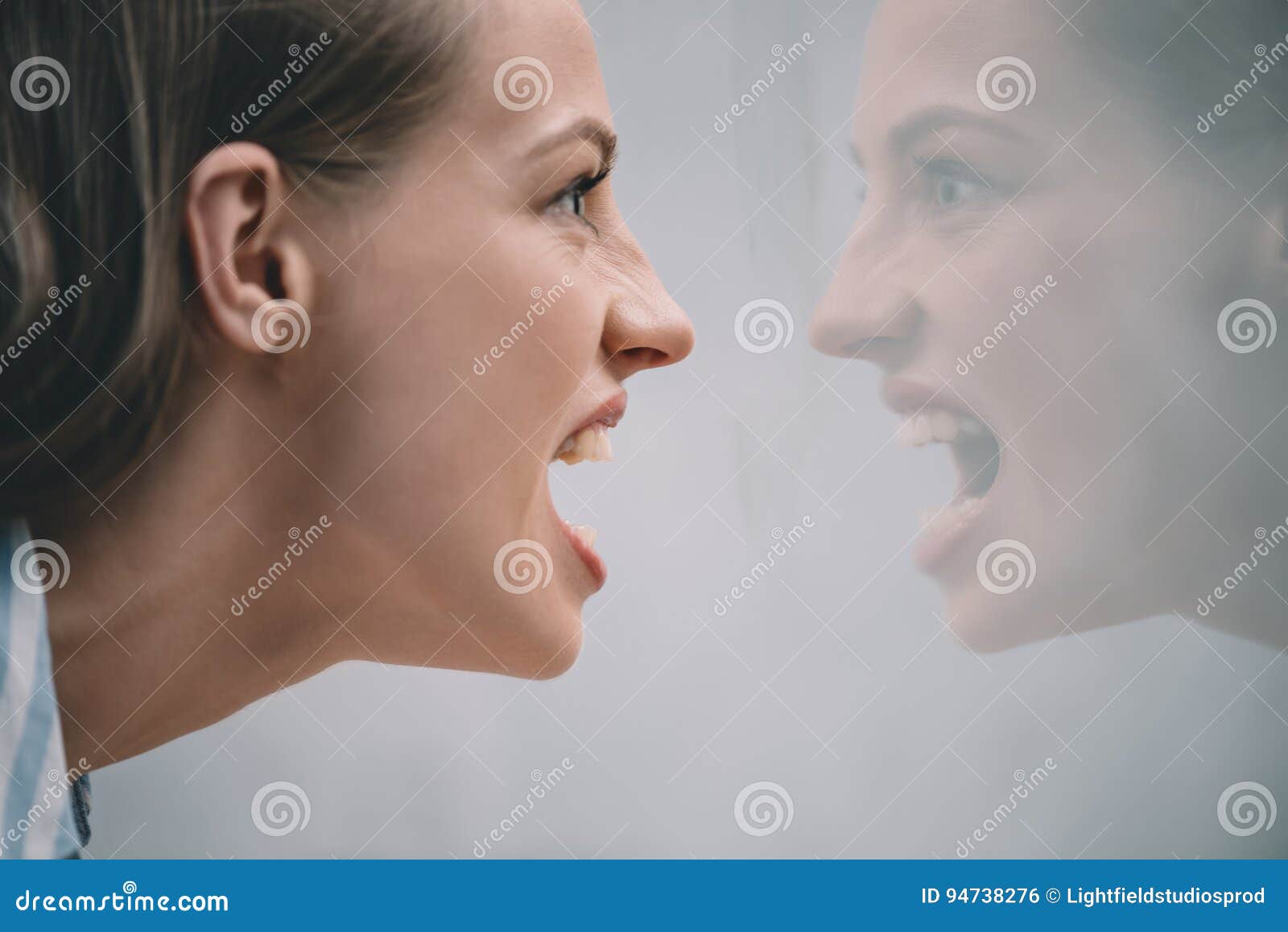 Stressed Woman Screaming at Her Reflection in Mirror Stock Photo ...