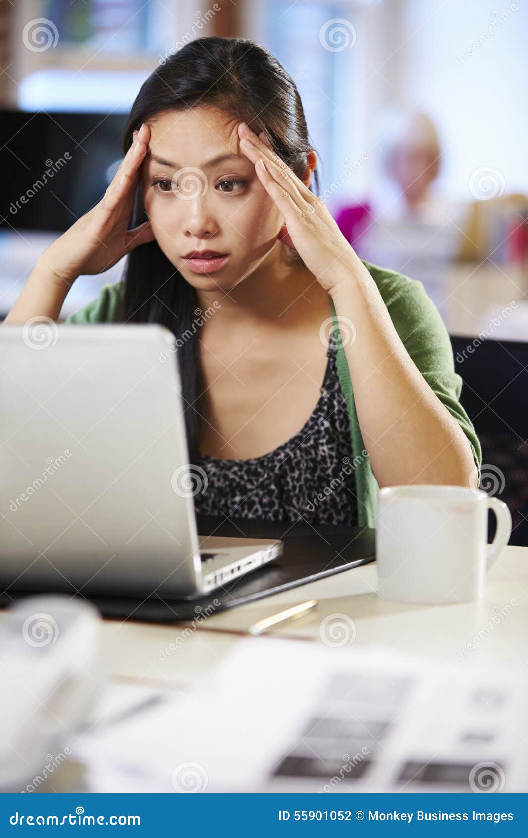 Stressed Woman Working at Laptop in Contemporary Office Stock Photo ...